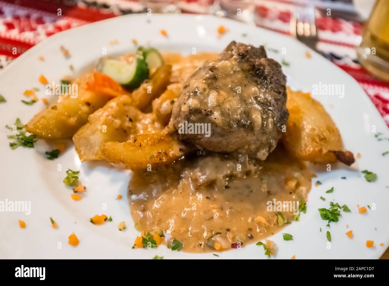 Traditional Hungarian food - potatos served with pork and vegetables ...