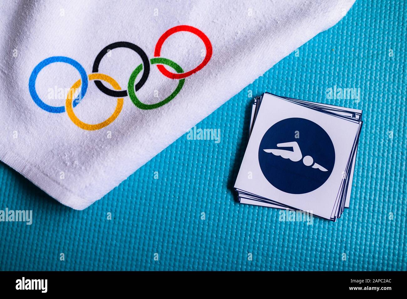TOKYO, JAPAN, JANUARY. 20. 2020: Swimming pictogram and olympic rings ...