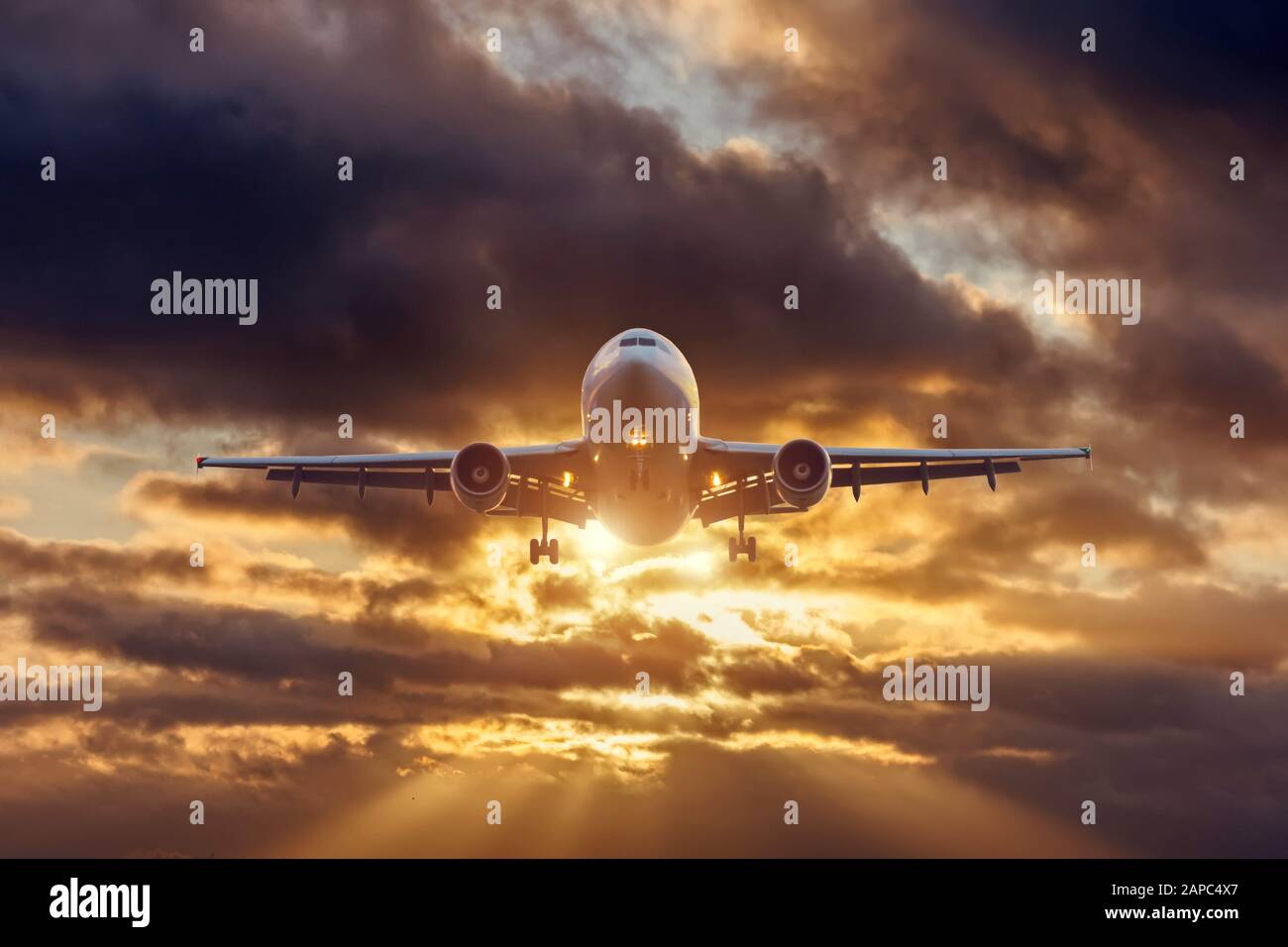 Jet aircraft flying over dramatic sunset dark clouds sky, fastest mode ...