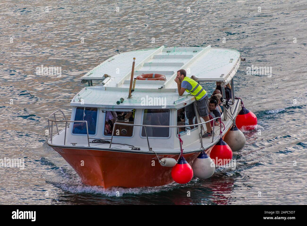 Red and White Tender Boat Stock Photo - Alamy