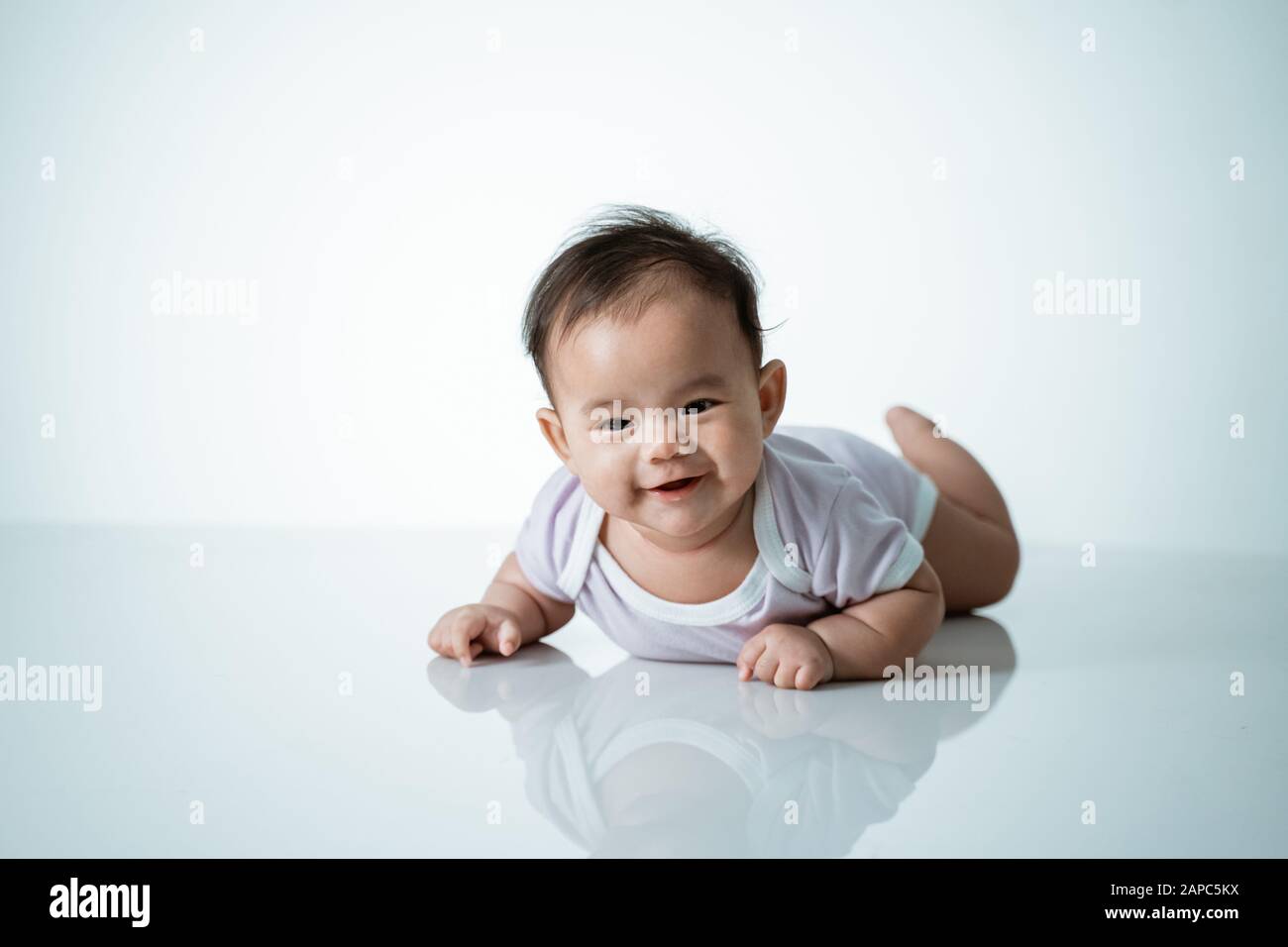 baby is on his stomach development Stock Photo - Alamy