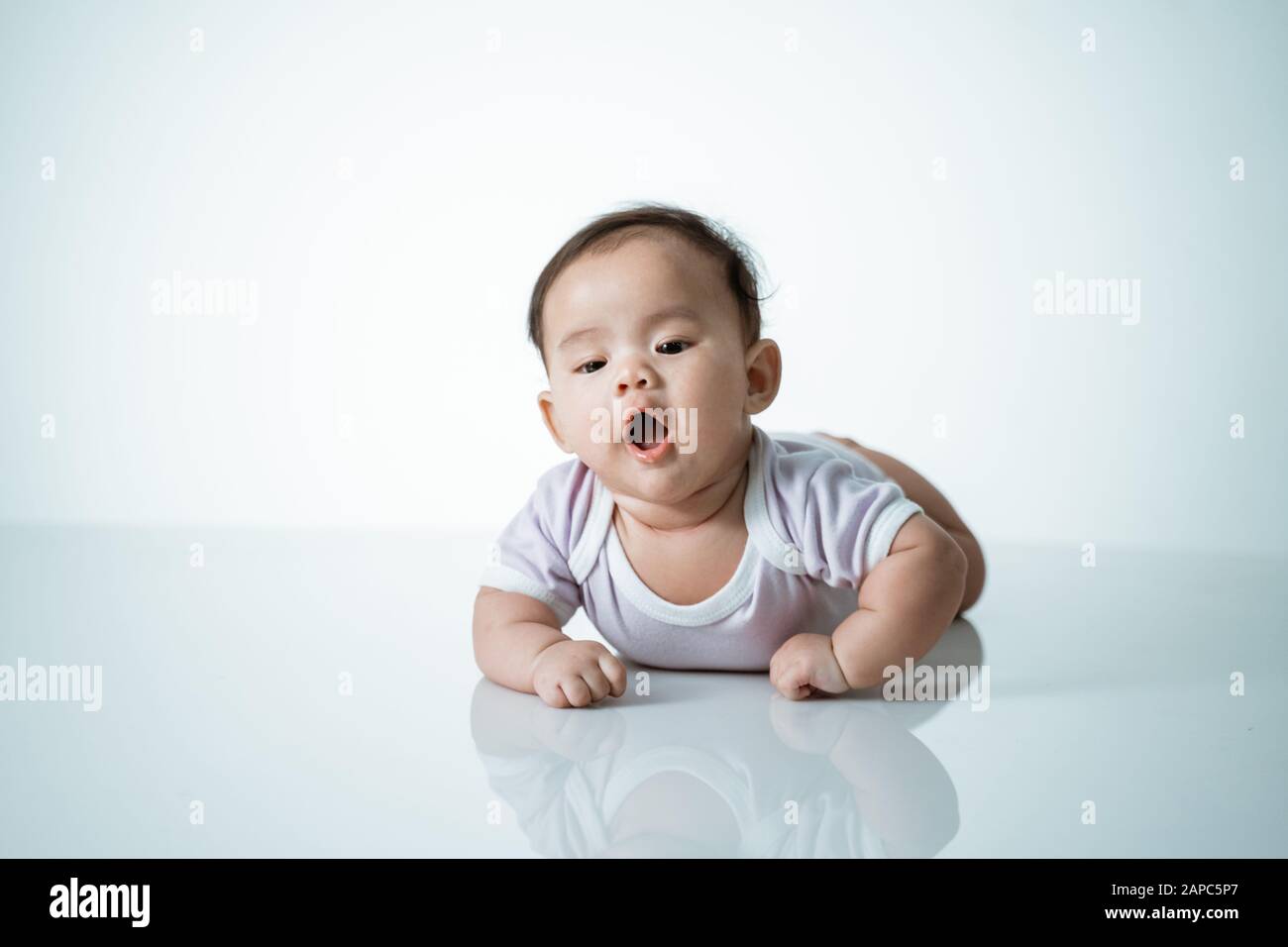 baby is on his stomach development Stock Photo - Alamy