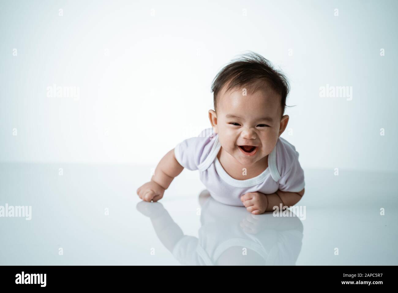 baby is on his stomach development Stock Photo - Alamy