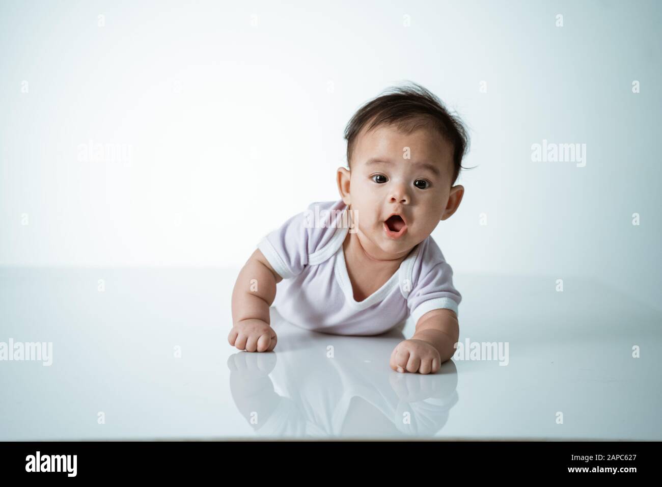 baby is on his stomach development Stock Photo - Alamy