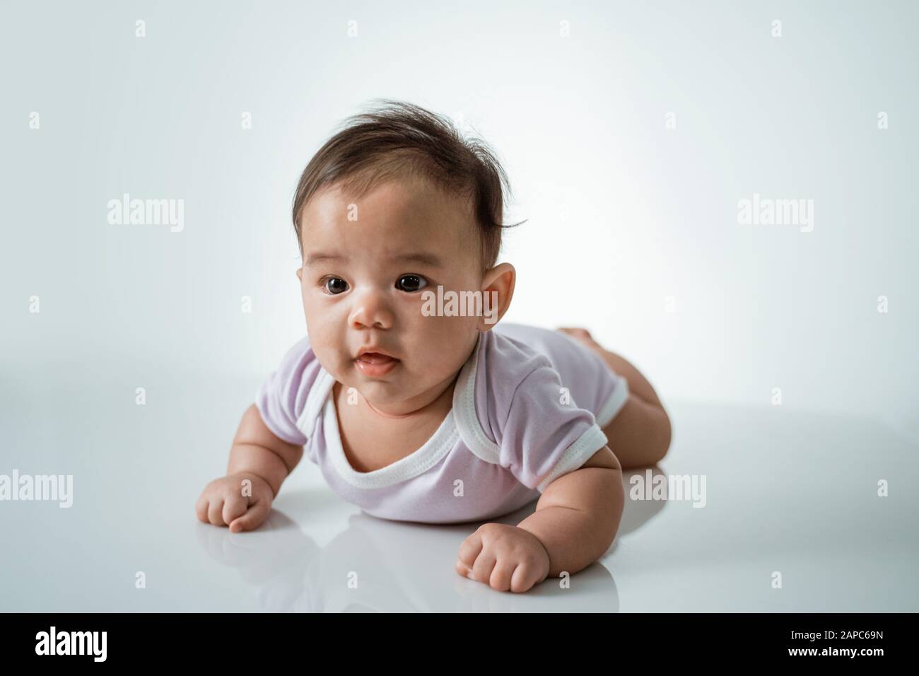 baby is on his stomach development Stock Photo - Alamy