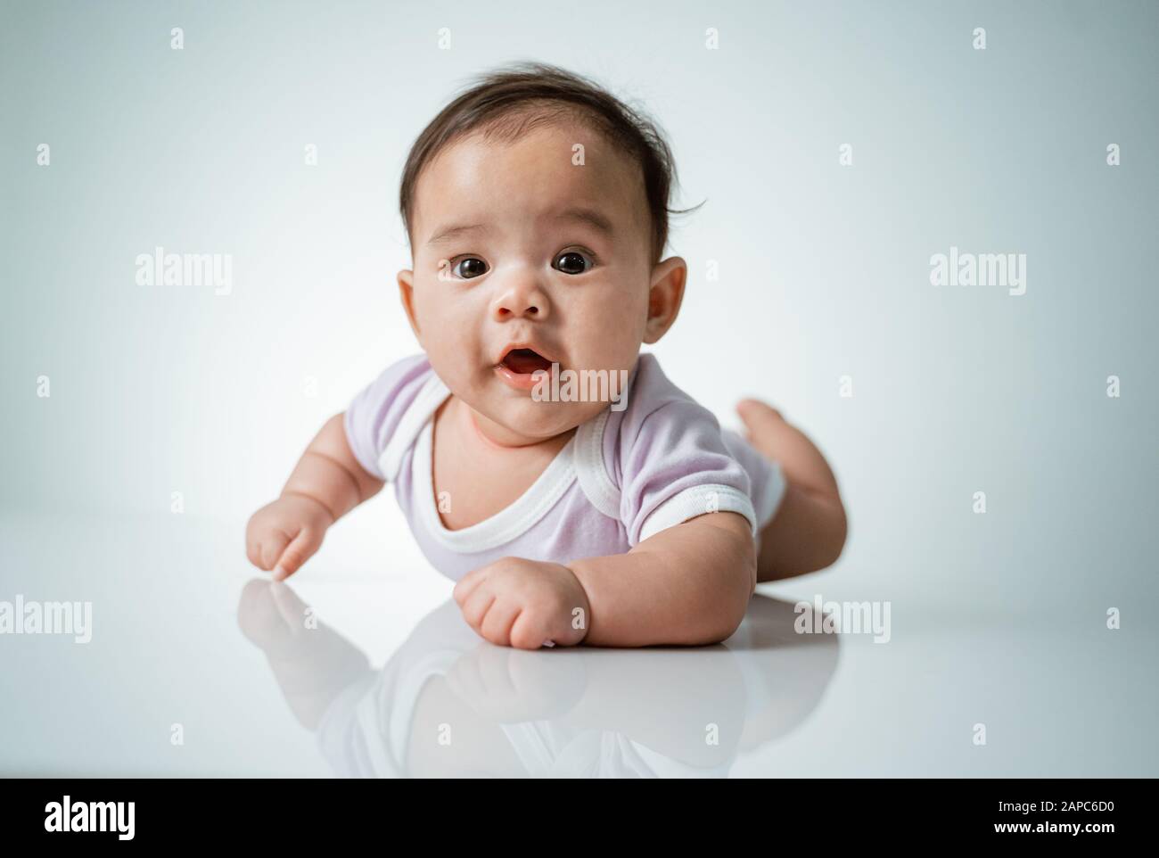baby is on his stomach development Stock Photo - Alamy