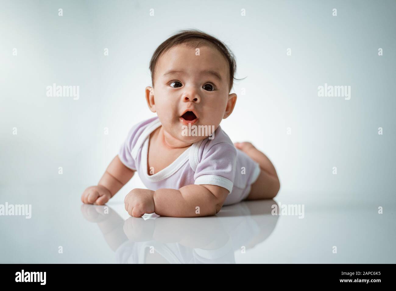 baby is on his stomach development Stock Photo - Alamy