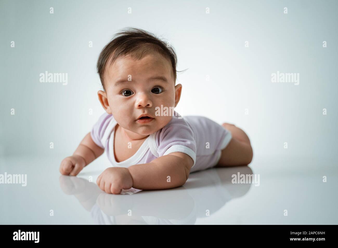 baby is on his stomach development Stock Photo - Alamy
