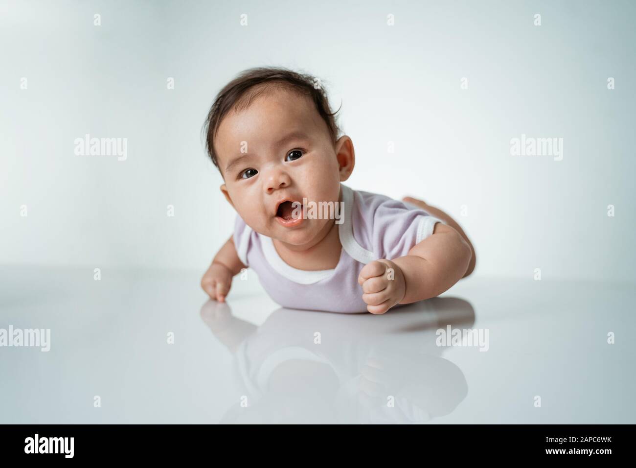baby is on his stomach development Stock Photo - Alamy