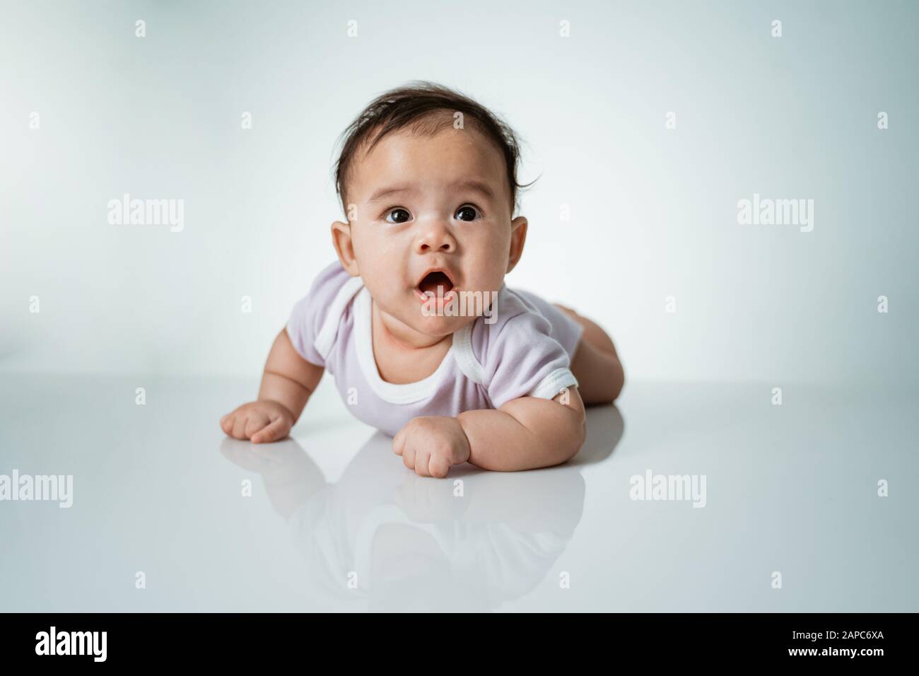baby is on his stomach development Stock Photo - Alamy