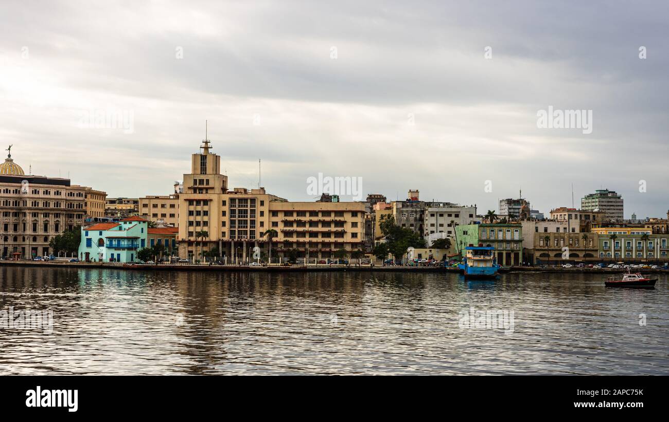 The colonial port of Havana and view over the city and Malecon seawall ...