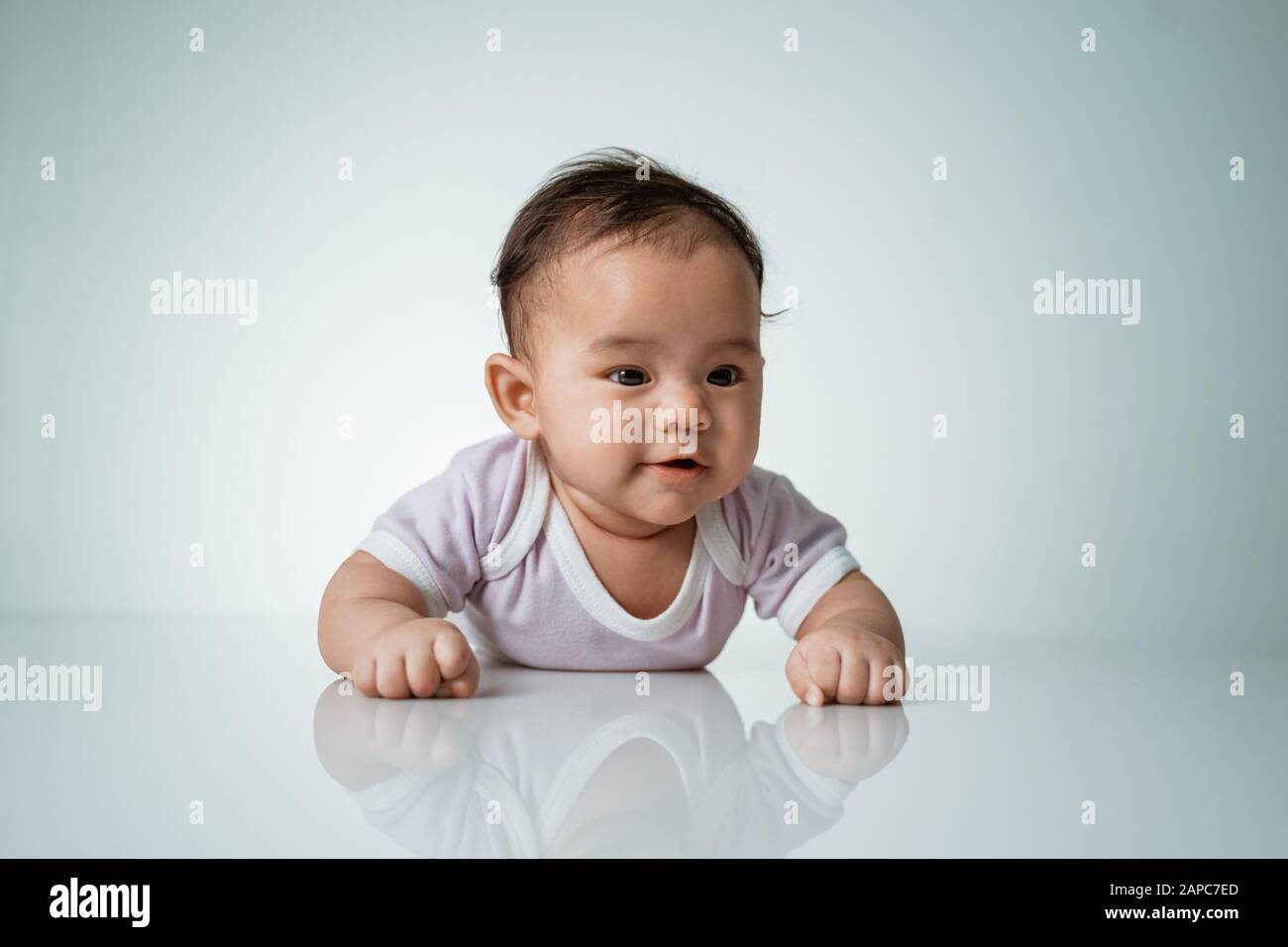 baby is on his stomach development Stock Photo - Alamy