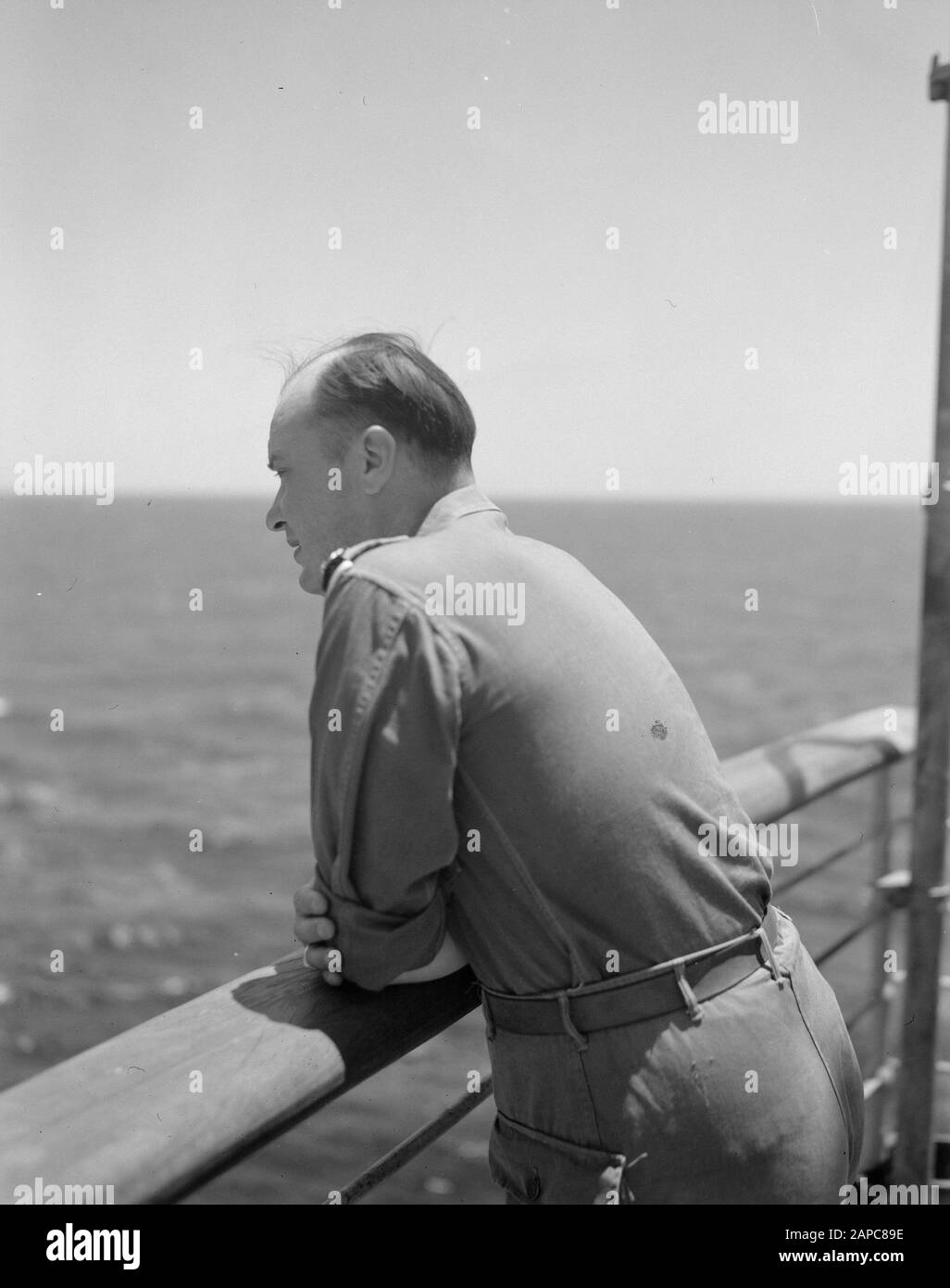 Man on railing Black and White Stock Photos & Images - Alamy