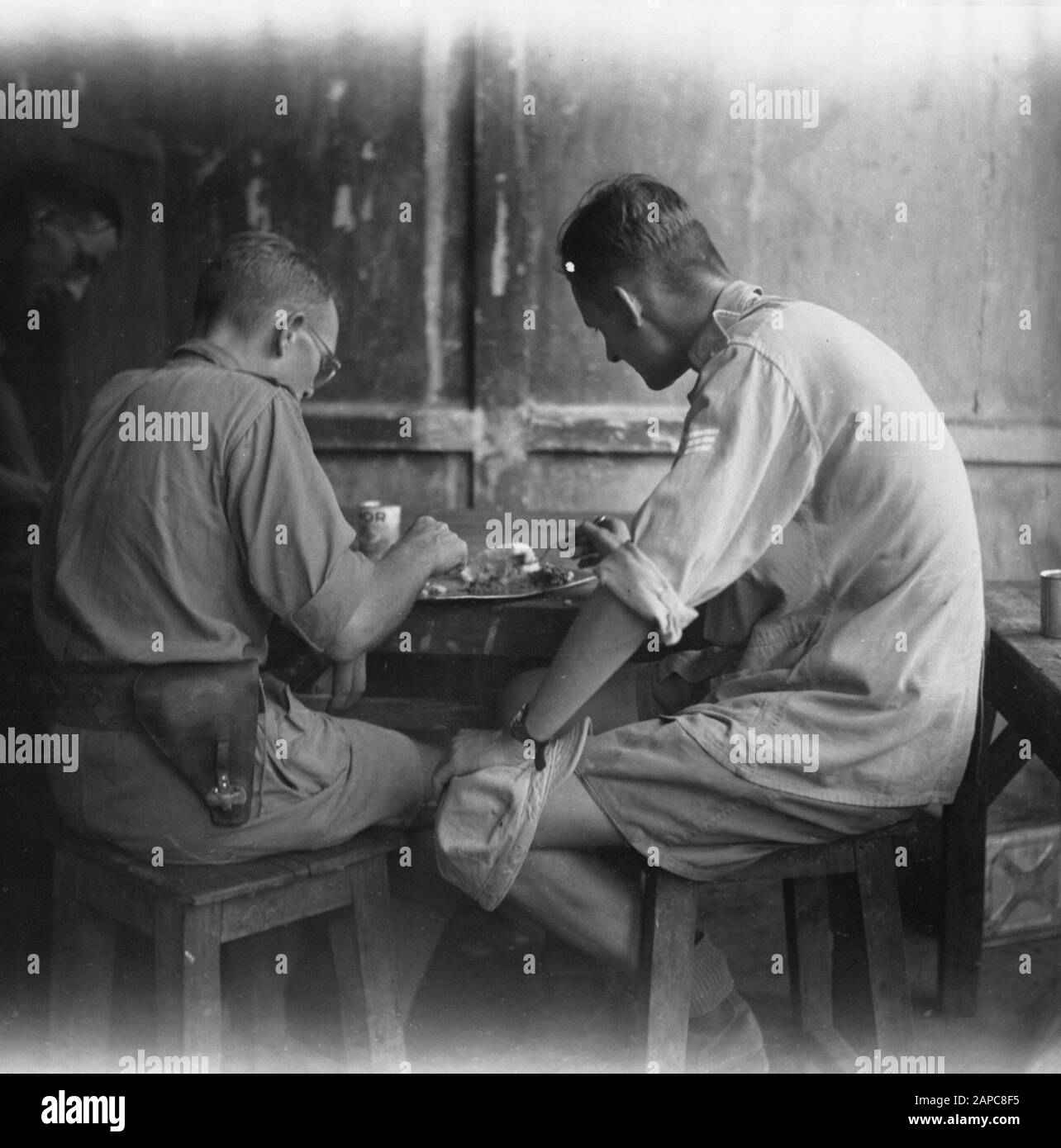 At the meal Date: 1947/01/01 Location: Indonesia, Dutch East Indies ...