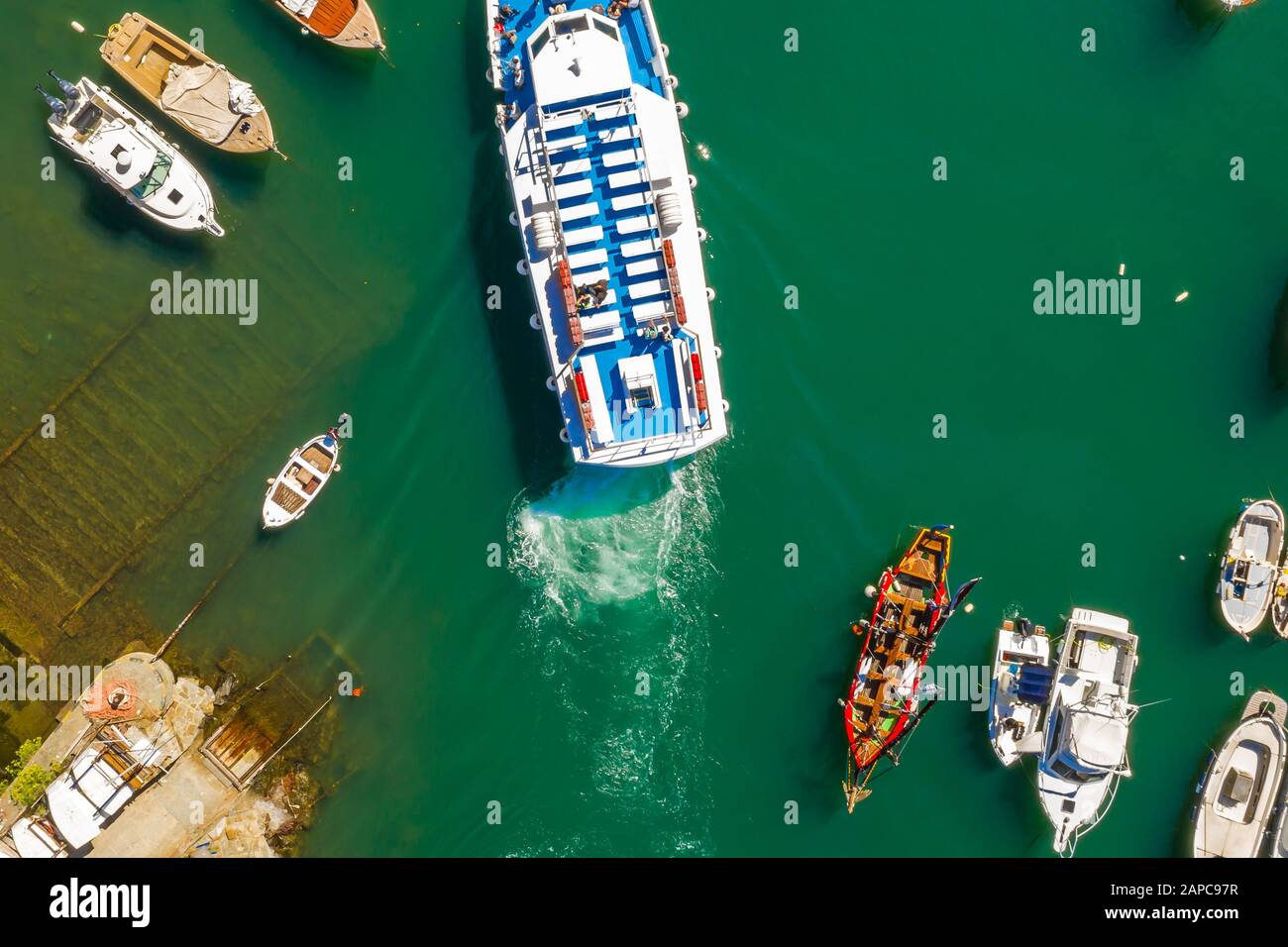 Cruise ship at harbor. Aerial view of beautiful yacht and boats in ...