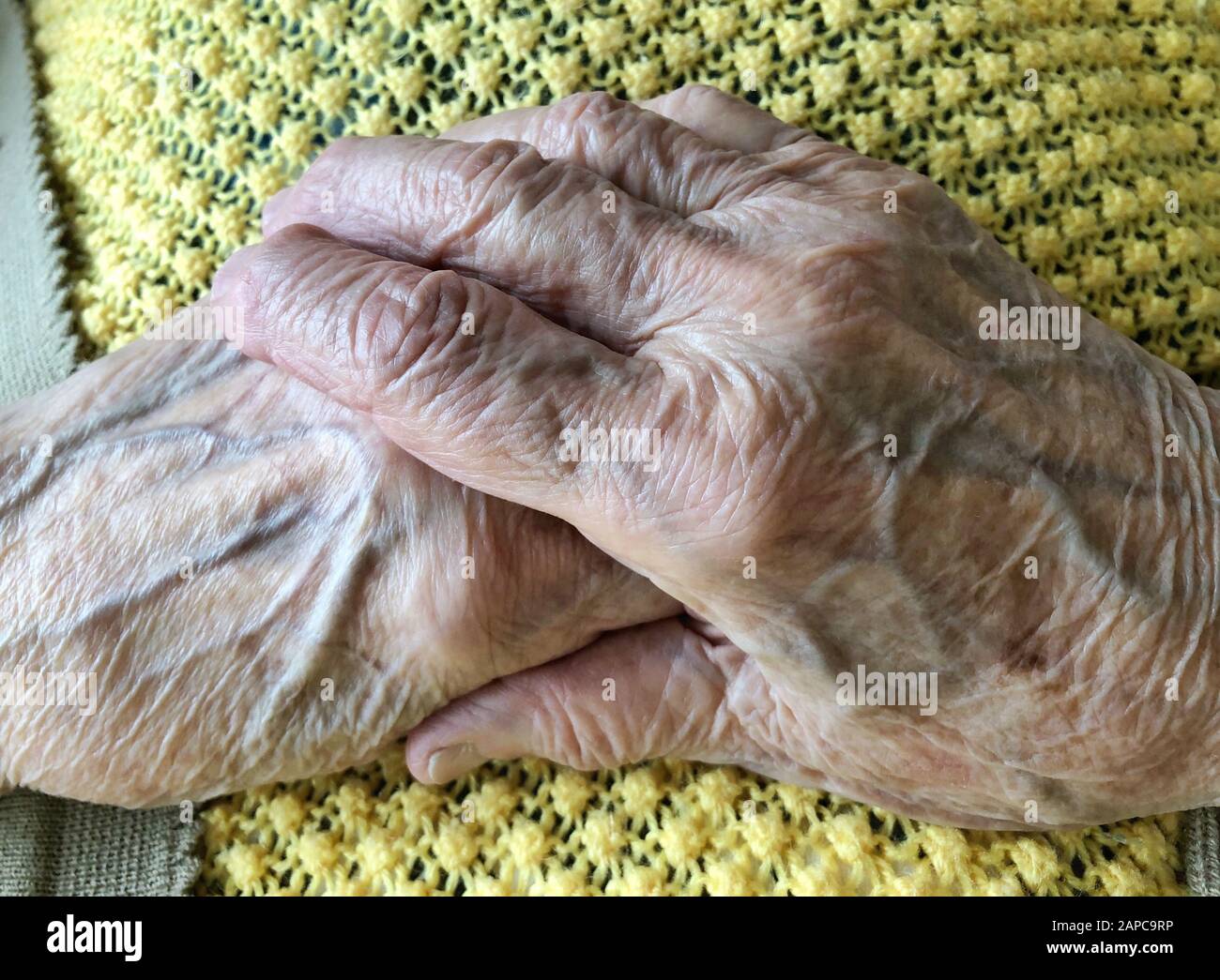 Closeup wrinkled hands of a senior person Stock Photo - Alamy
