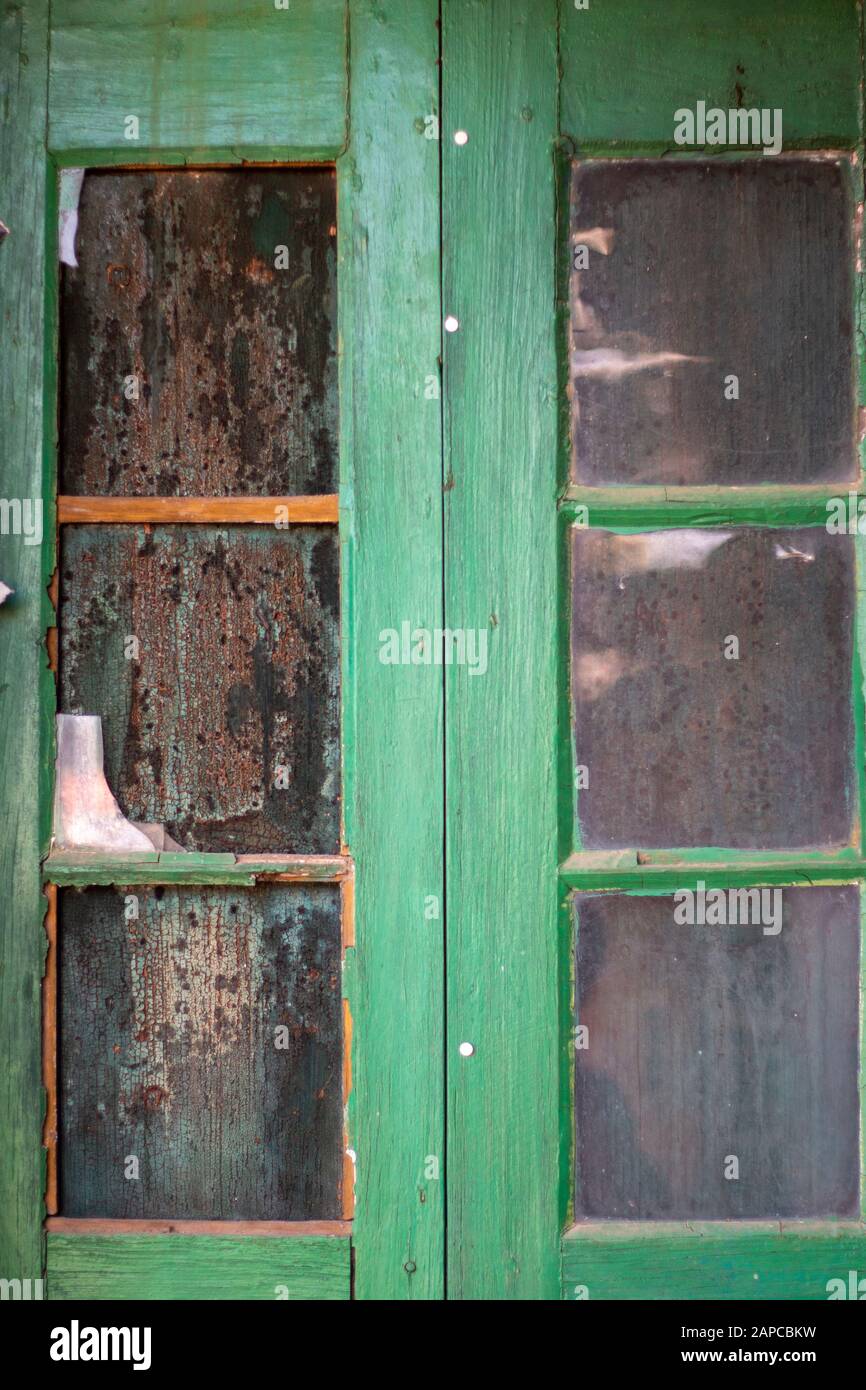 old green decaying wooden window on an abandoned house Stock Photo - Alamy