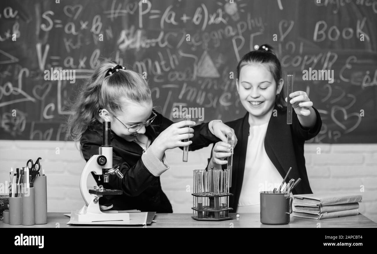 Really busy. Little girls in school lab. Science is future. Little ...