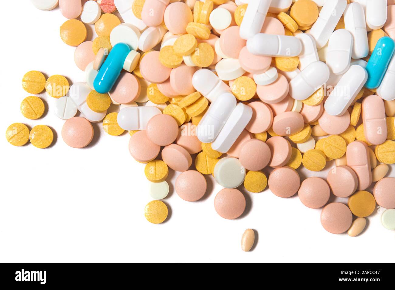 Assorted mix of pills over a white background Stock Photo - Alamy