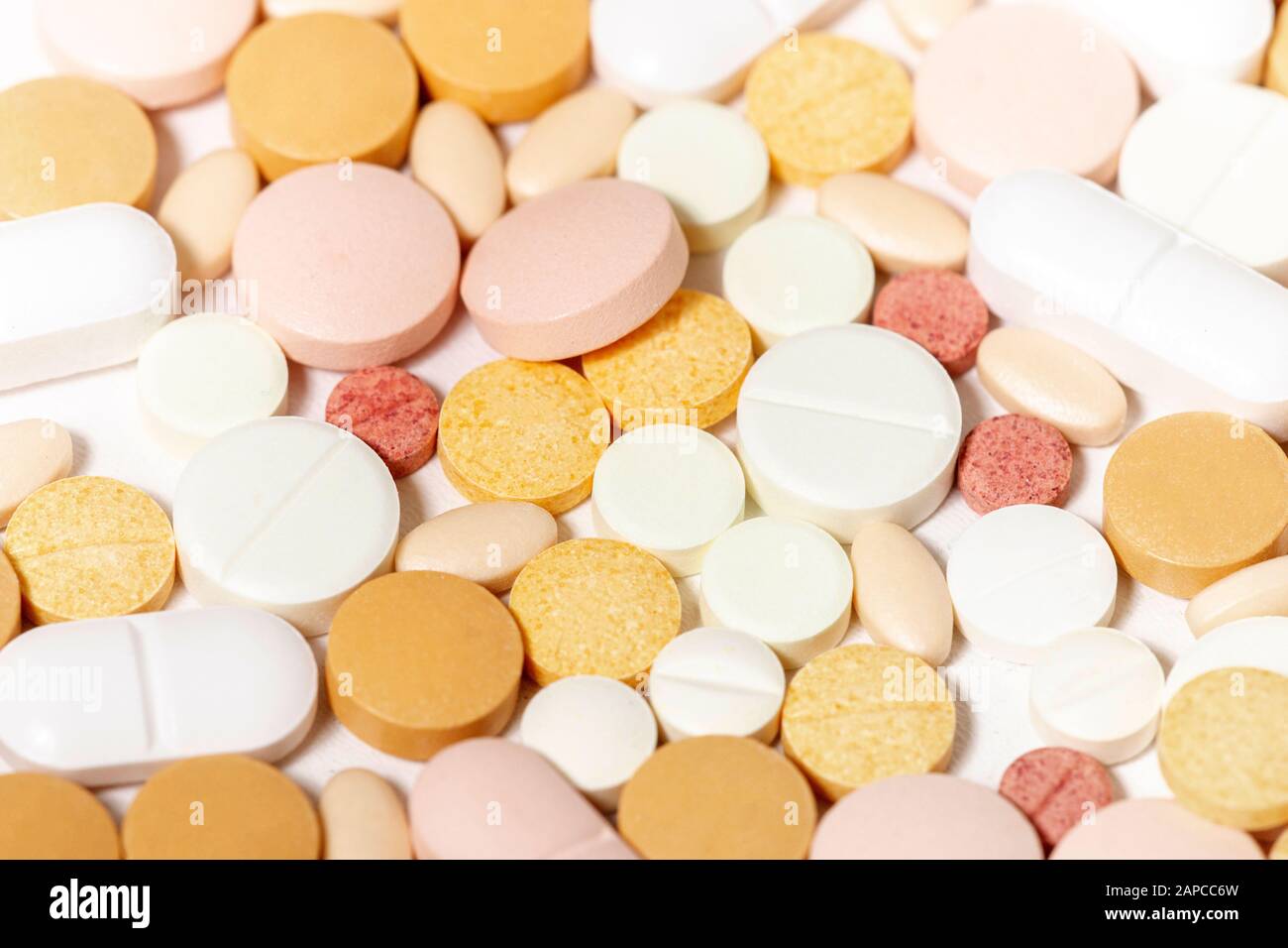 Assorted mix of pills over a white background Stock Photo - Alamy