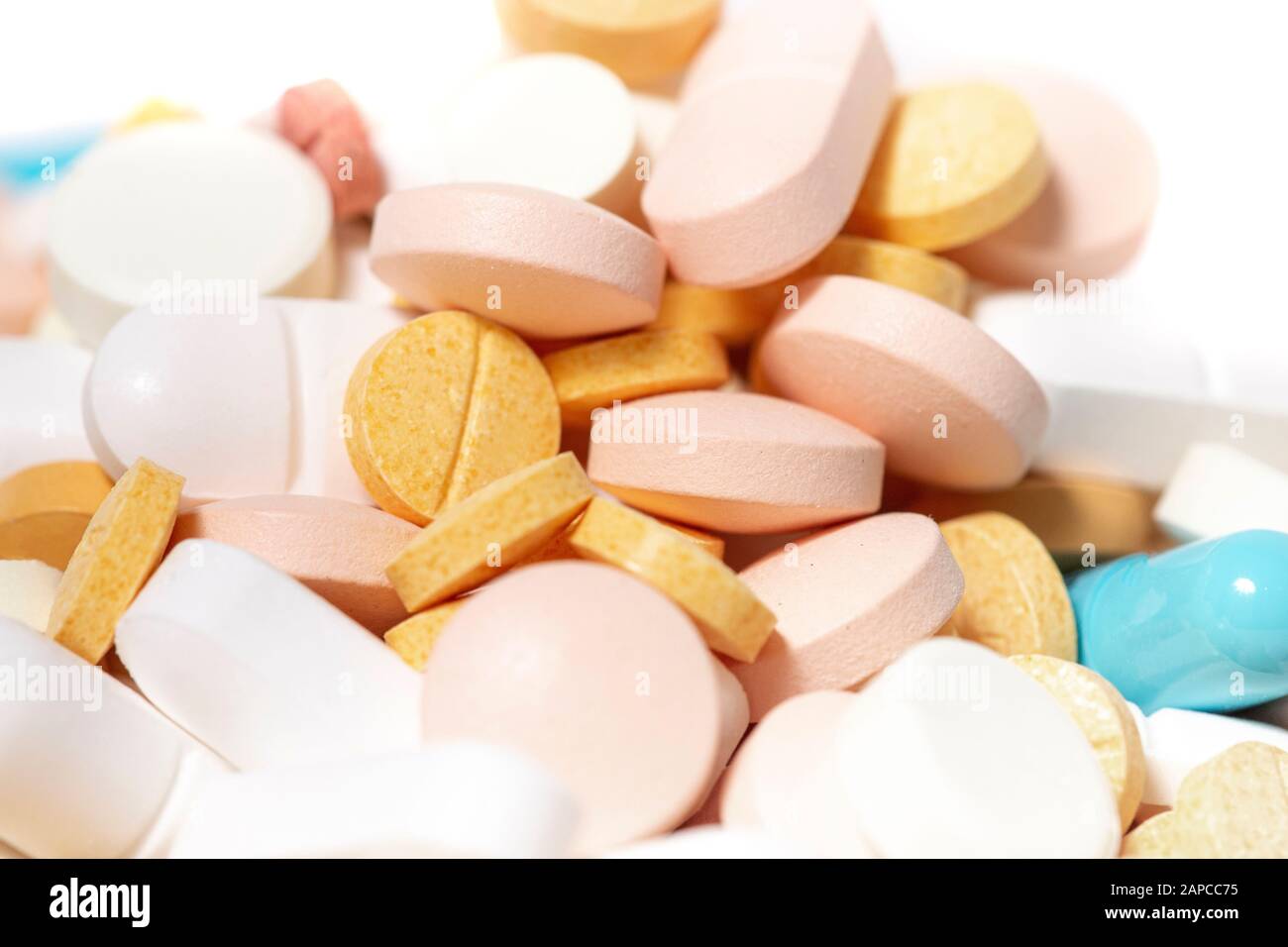 Assorted mix of pills over a white background Stock Photo - Alamy