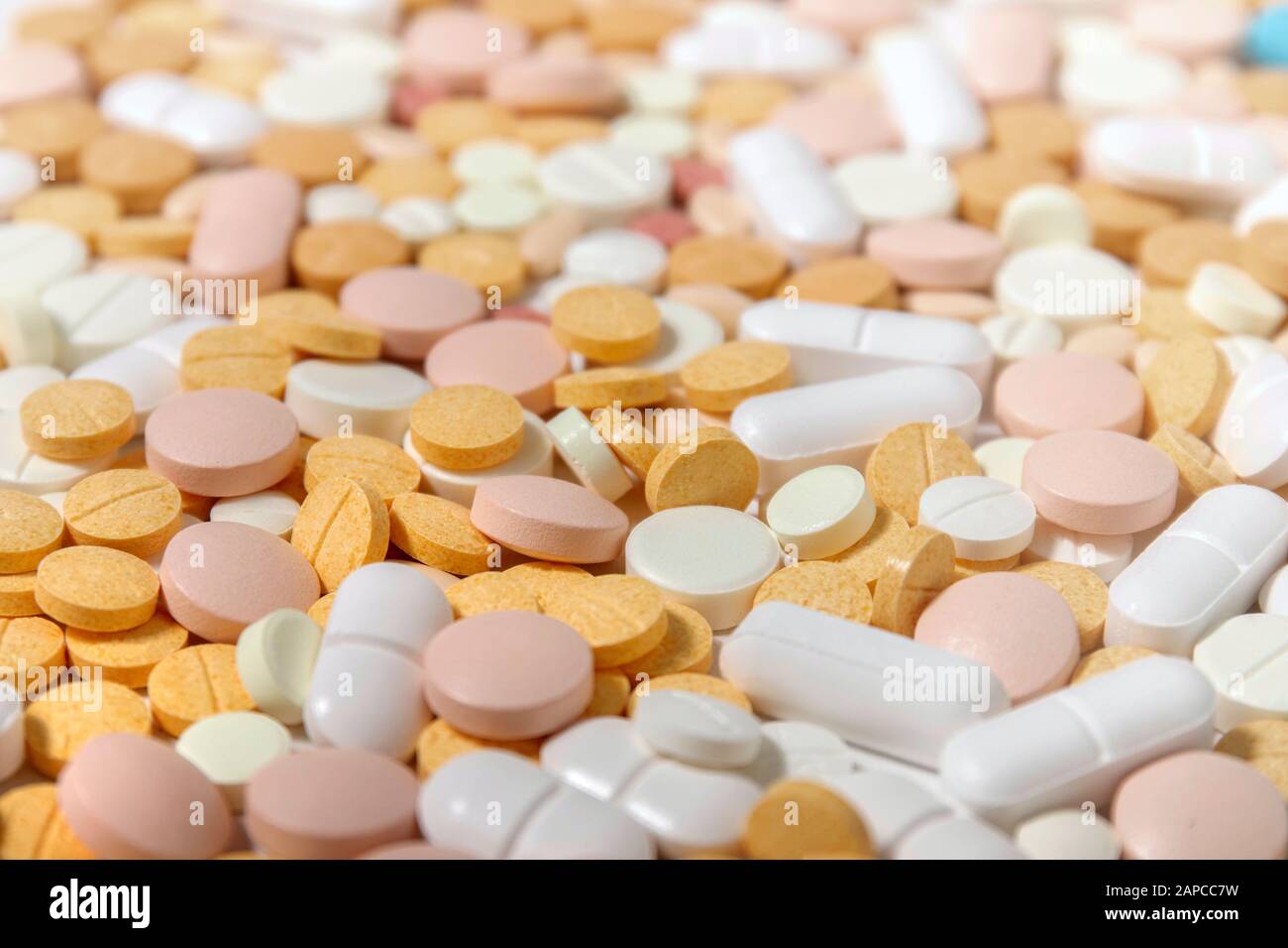Assorted mix of pills over a white background Stock Photo - Alamy