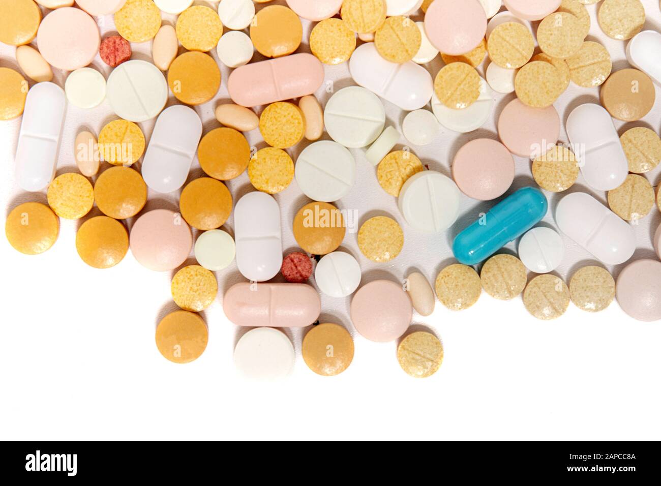 Assorted mix of pills over a white background Stock Photo - Alamy