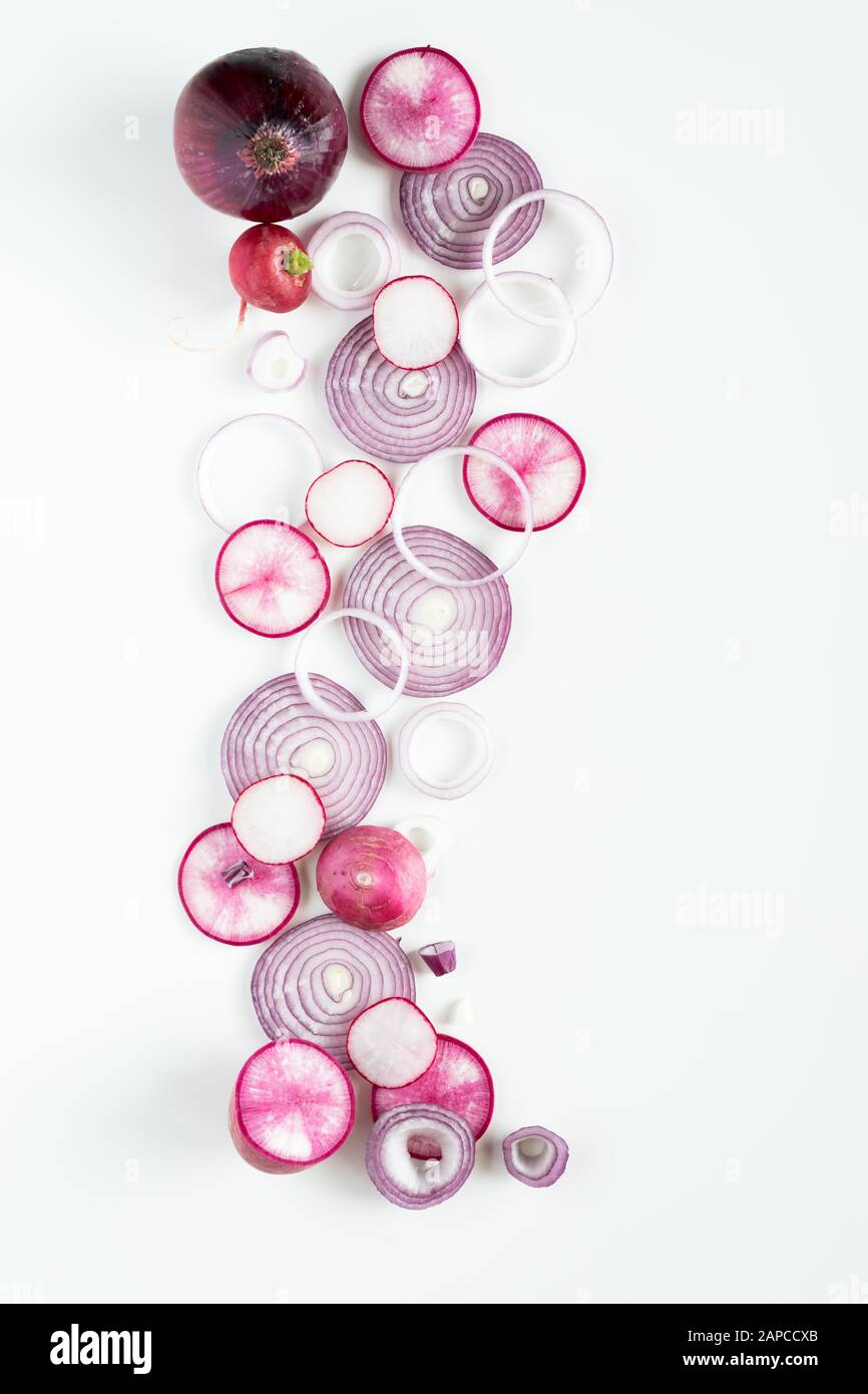 Top down view of an abstract curve arrangement of red onion slices ...