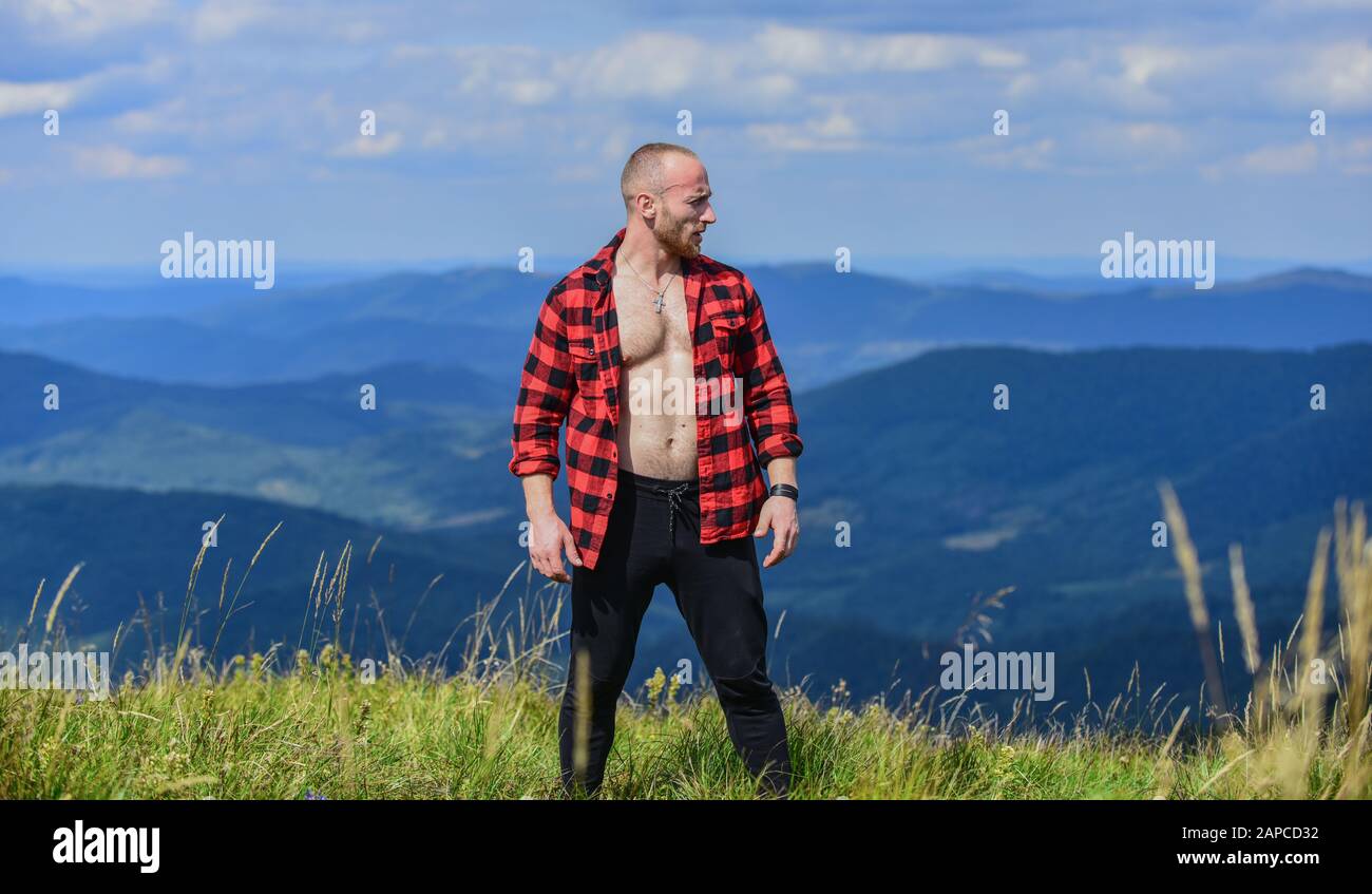 Man stand top mountain landscape background. Athlete guy relax ...