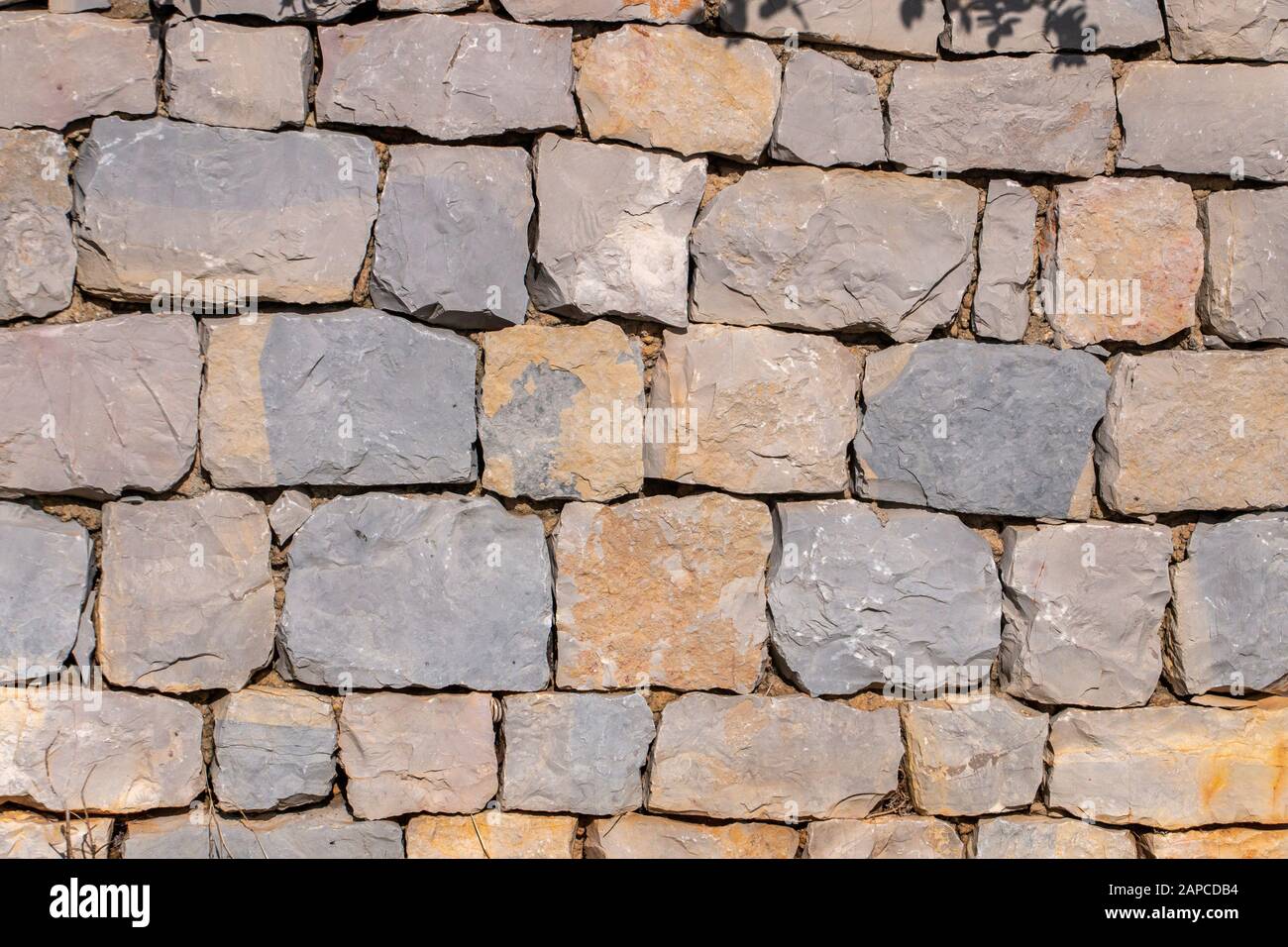 Rural stone wall texture on the sunlight Stock Photo - Alamy