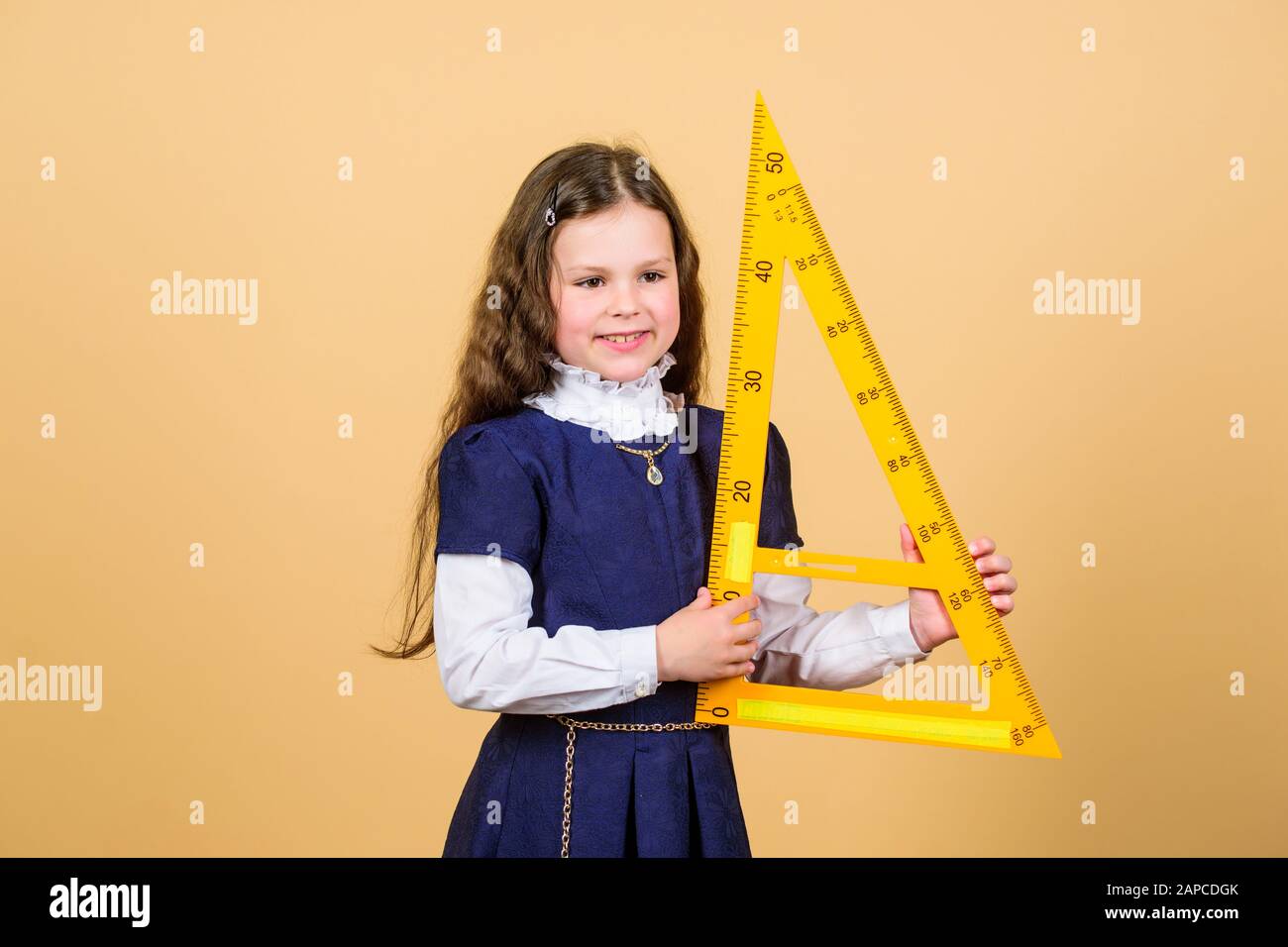 School student learning geometry. Pupil girl with big ruler. STEM ...