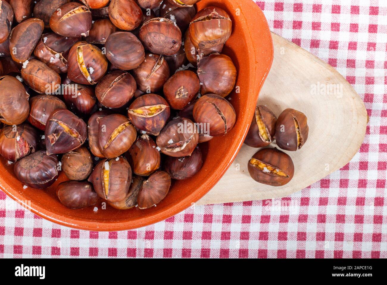 View of traditional portuguese dish of roasted chestnuts with salt ...