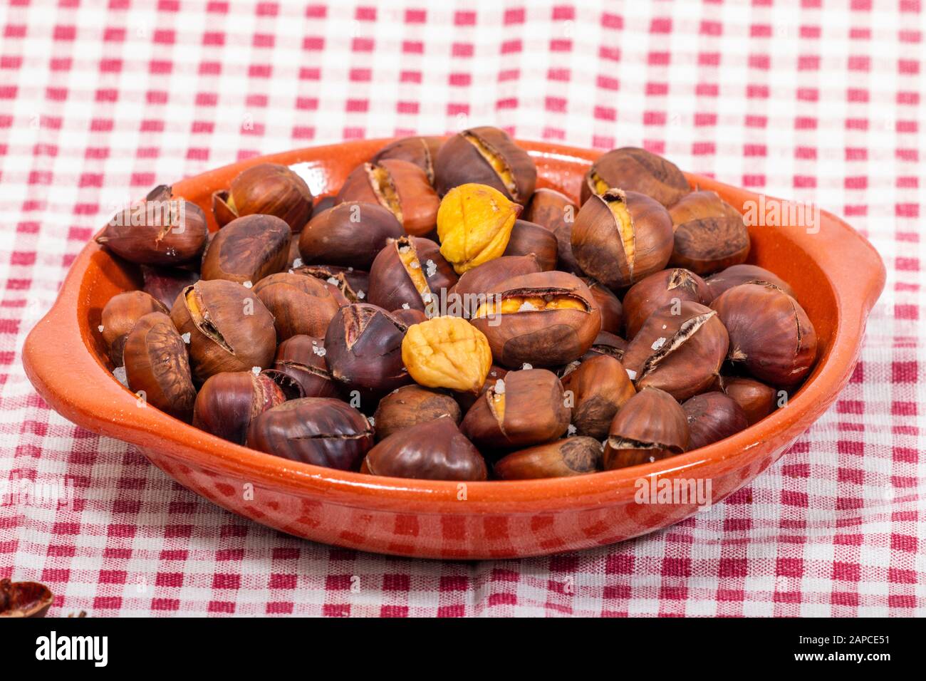 View of traditional portuguese dish of roasted chestnuts with salt ...