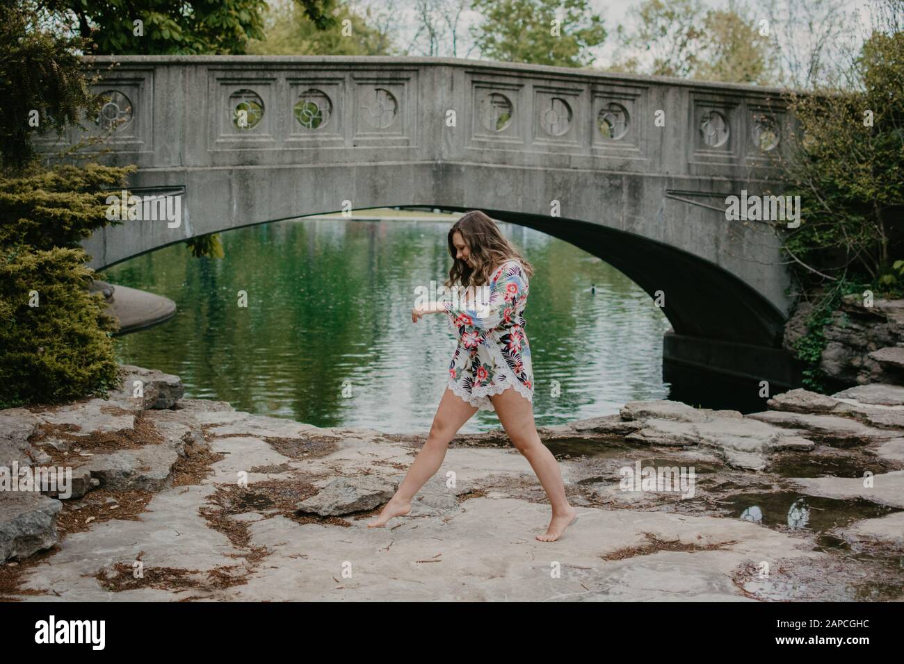 Girl at pond Stock Photo - Alamy