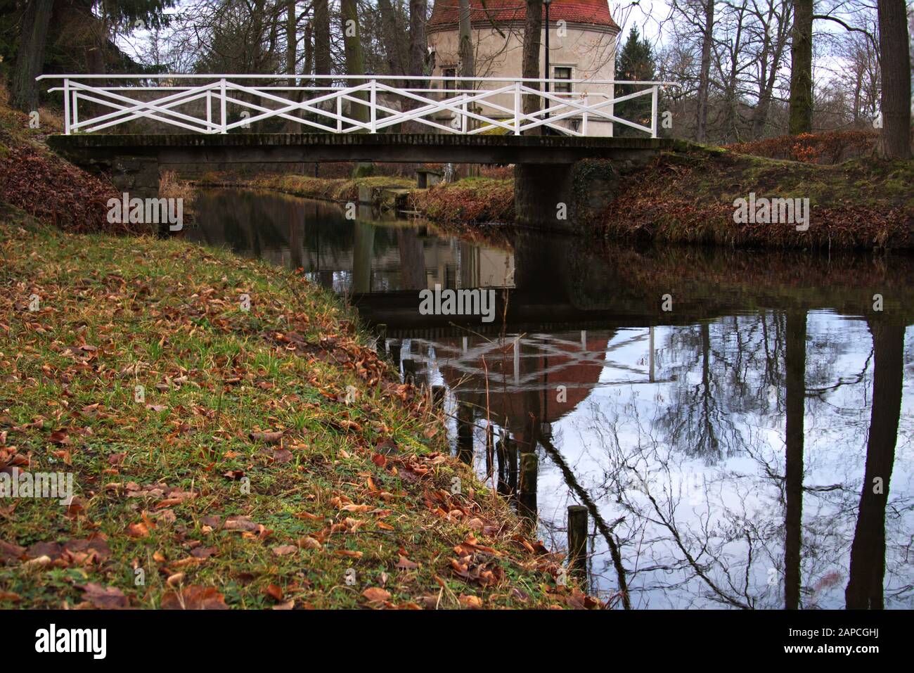 Bridge over calm river Stock Photo - Alamy