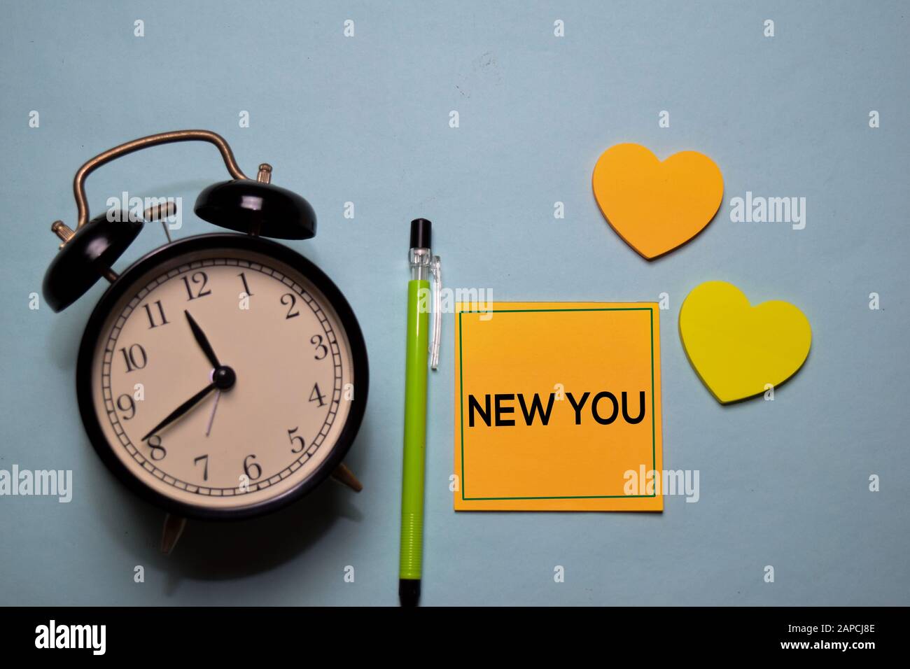 New You write on a sticky note isolated on office desk Stock Photo - Alamy