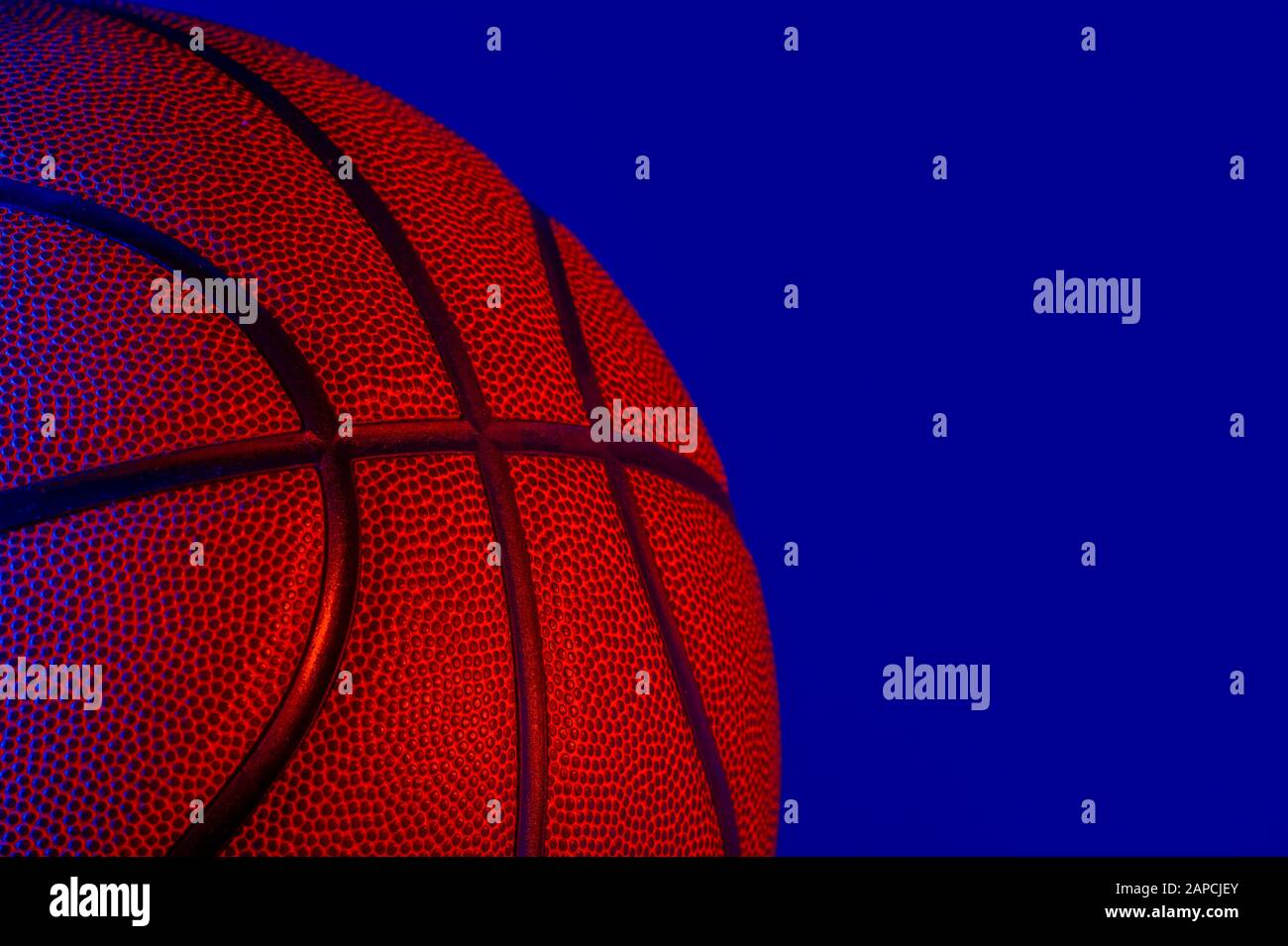 Closeup detail of basketball ball texture background. Blue neon Banner ...