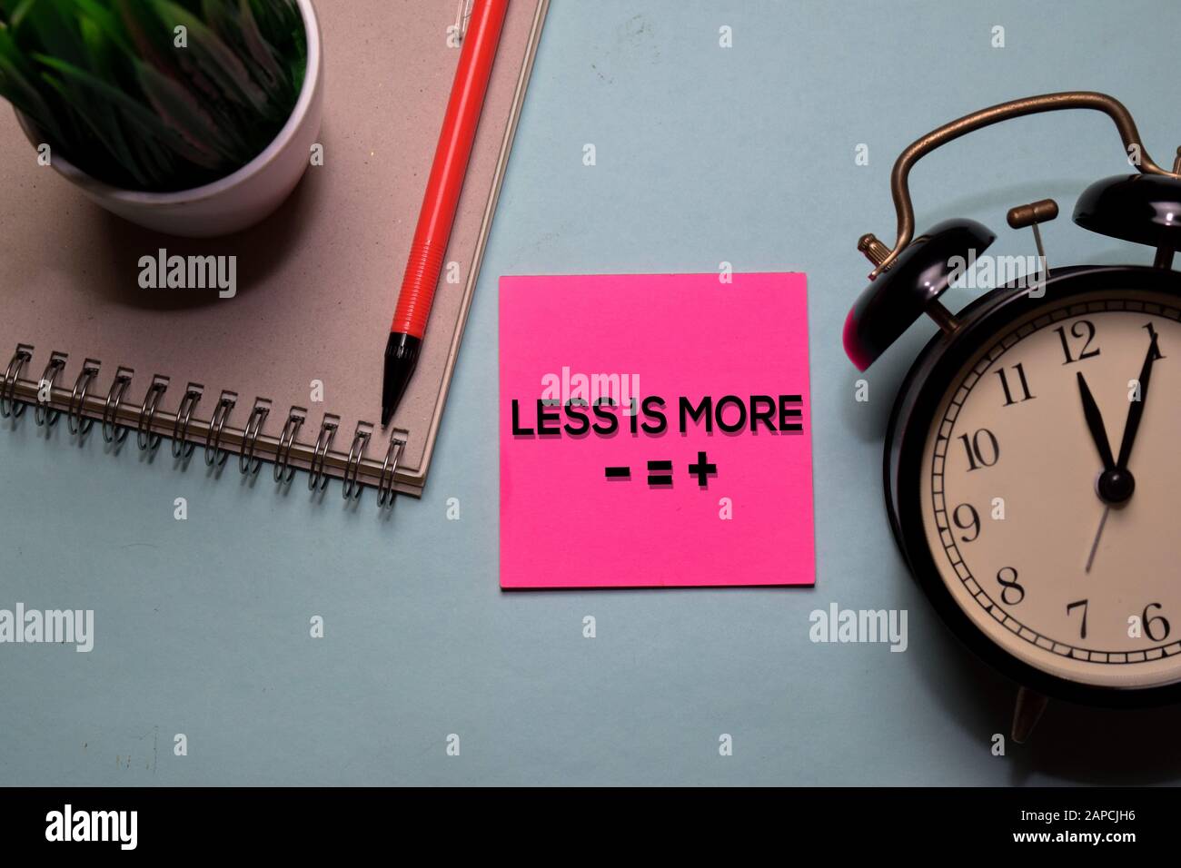 Less is More write on a sticky note isolated on office desk Stock Photo ...
