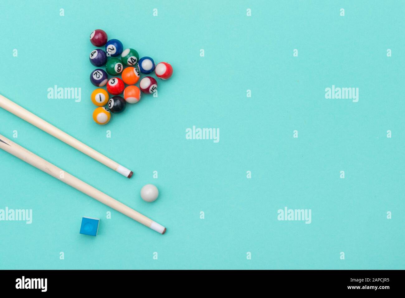 Pool Billiard equipments on a green background Stock Photo - Alamy