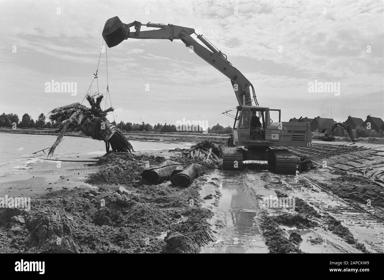 Construction of new dike near former island Marken; work on dike with ...