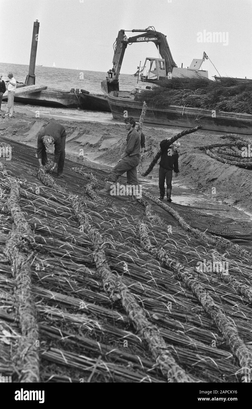 Construction of new dike near former island Marken; work on dike with ...