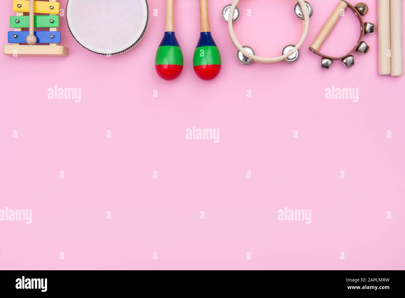 Musical instruments on pink background Stock Photo - Alamy