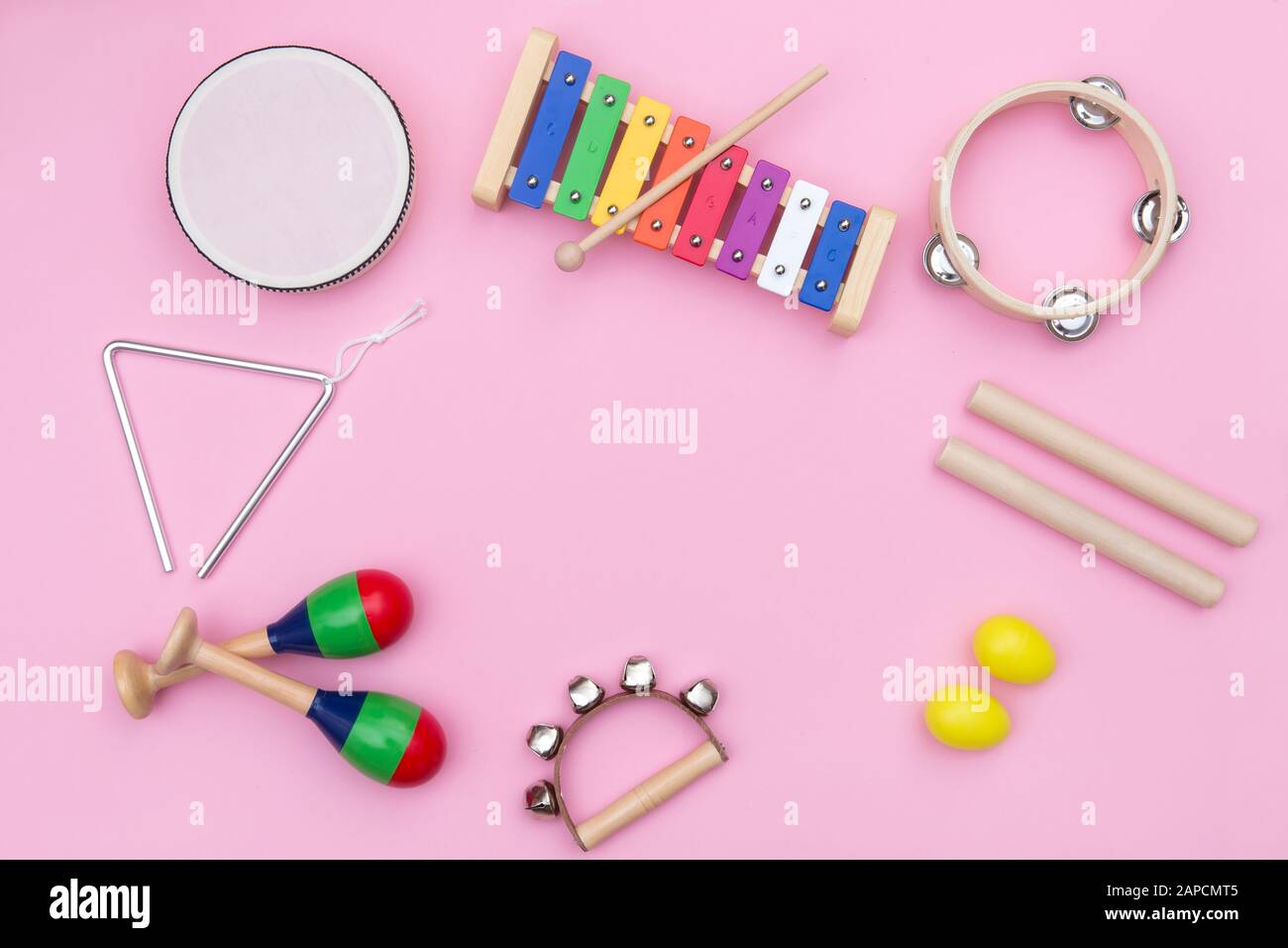 Musical instruments on pink background Stock Photo - Alamy