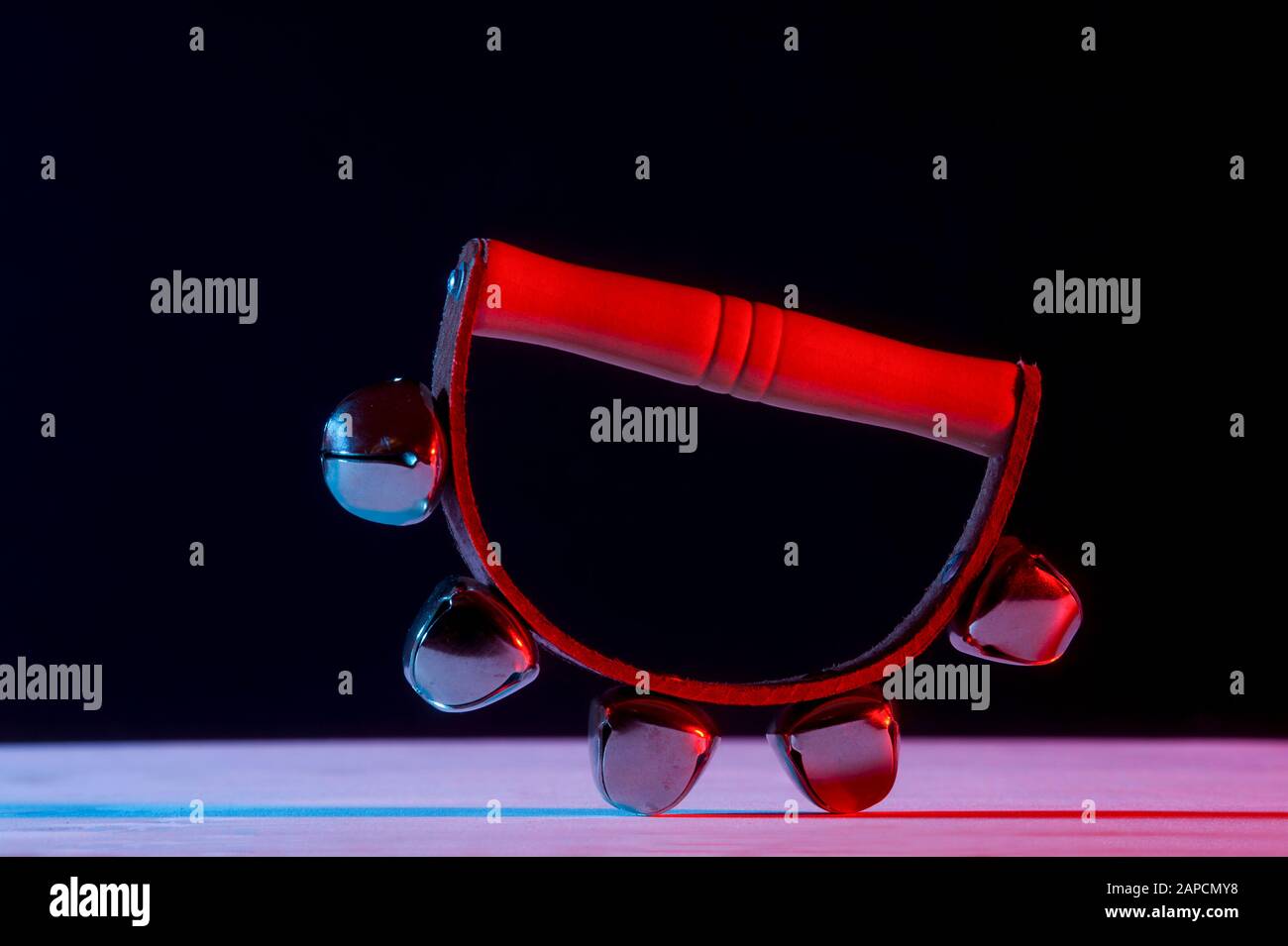 Hand bells musical instrument for ringing on black background Stock ...