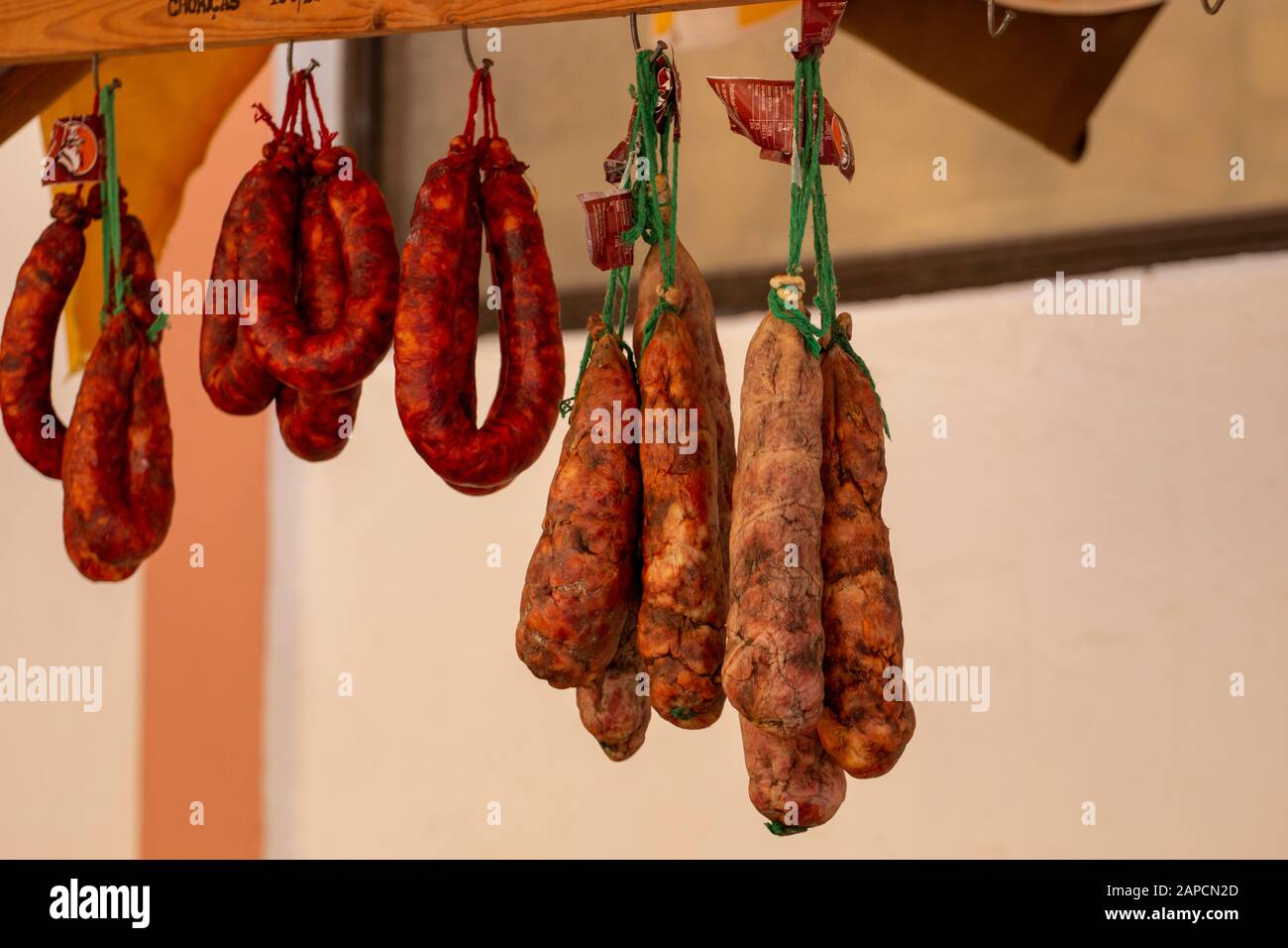 Variety of chorizos hanging for sale Stock Photo - Alamy