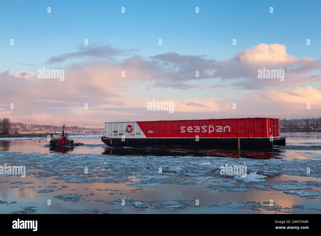 Industrial Tugboat pulling a load in Fraser River during a colorful ...