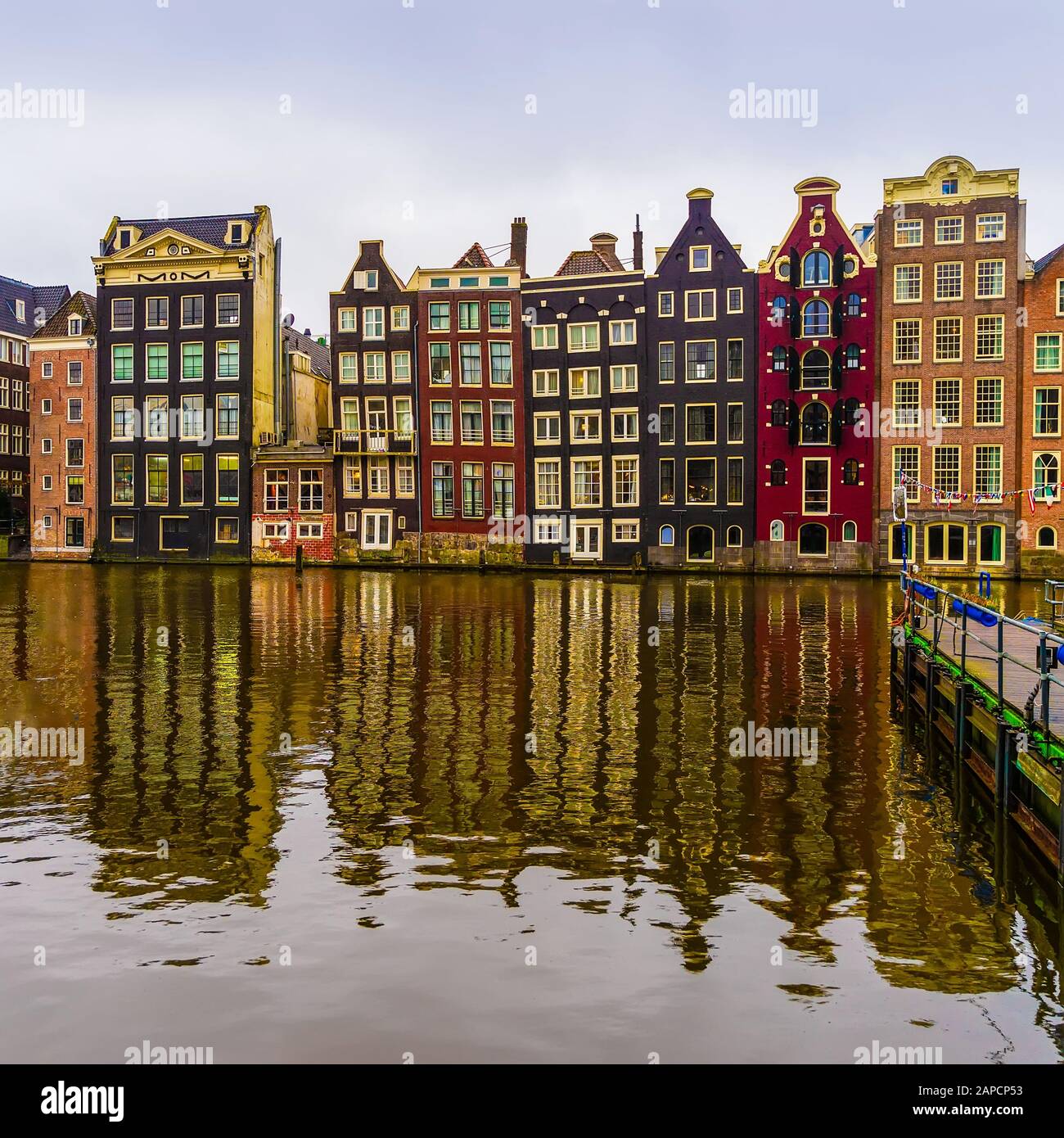 Old dutch medieval houses in Amsterdamon, view through the canal Stock ...