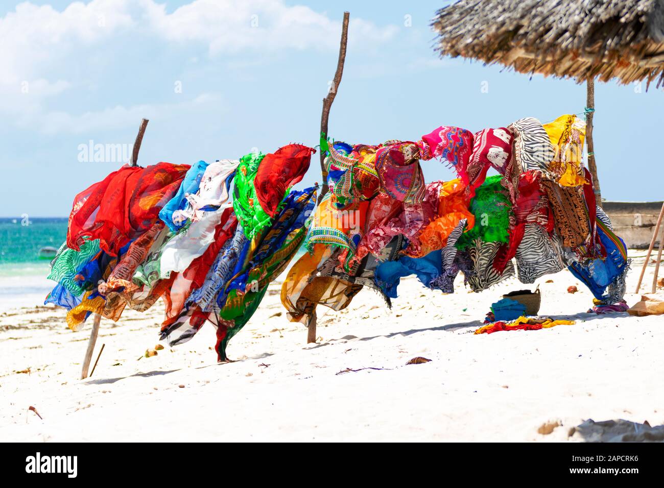 Multicolored textiles on the beach Stock Photo - Alamy