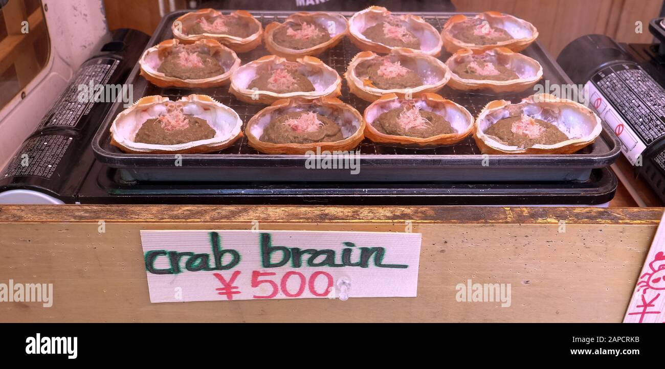 wide shot of crab brain being sold at tsukiji market in japan Stock ...