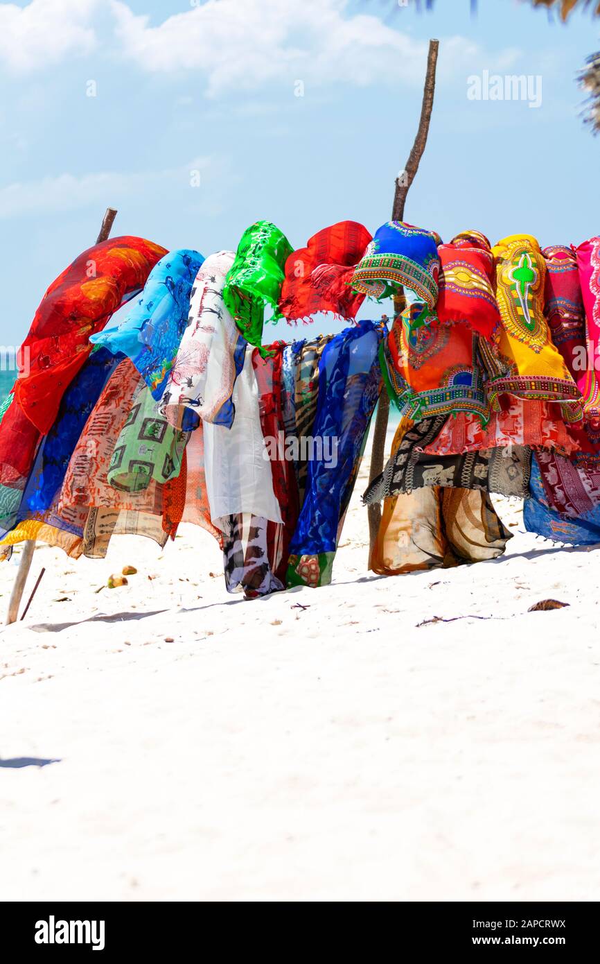 Multicolored textiles on the beach Stock Photo - Alamy